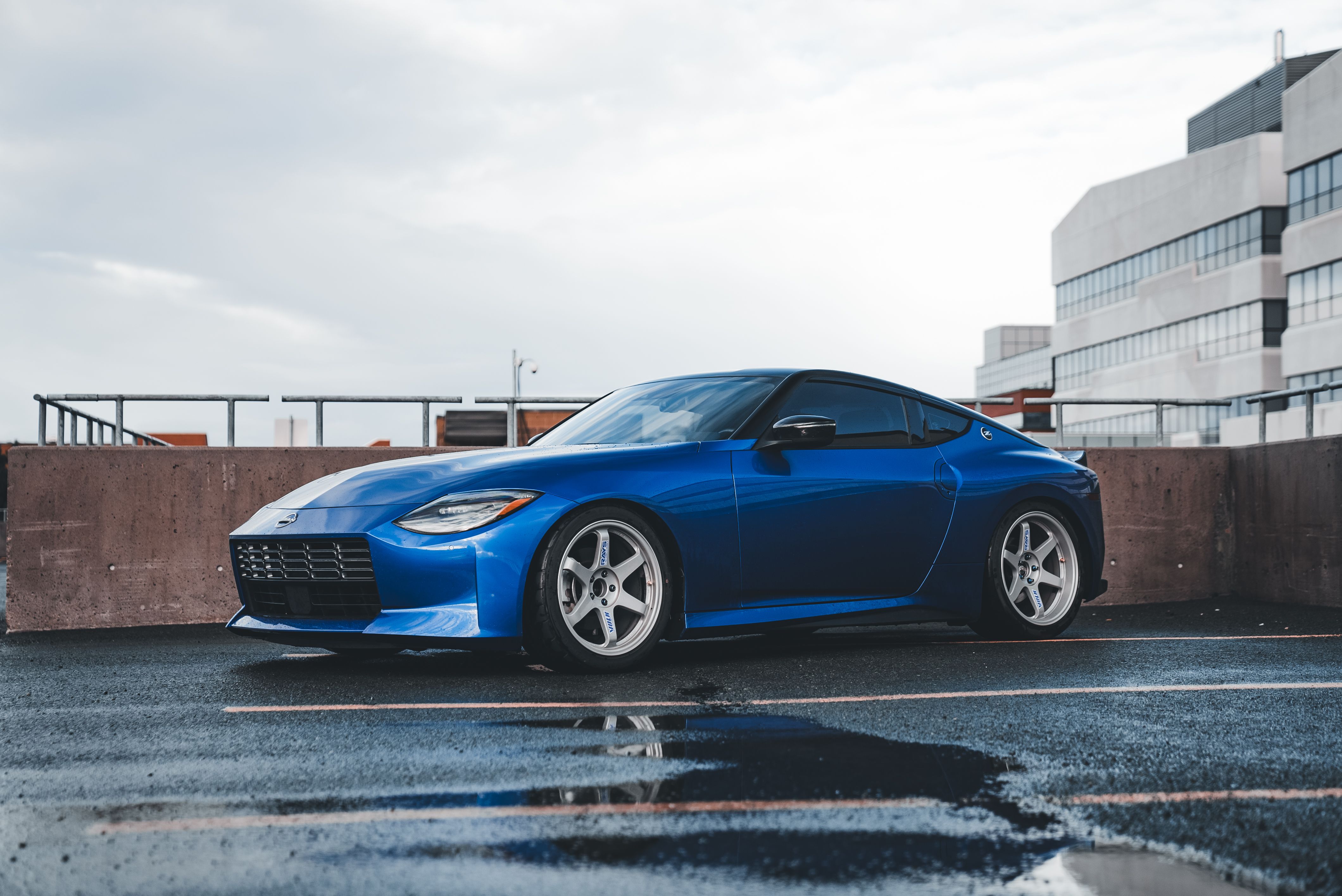 Sleek Blue Sports Car in Urban Setting · Free Stock Photo