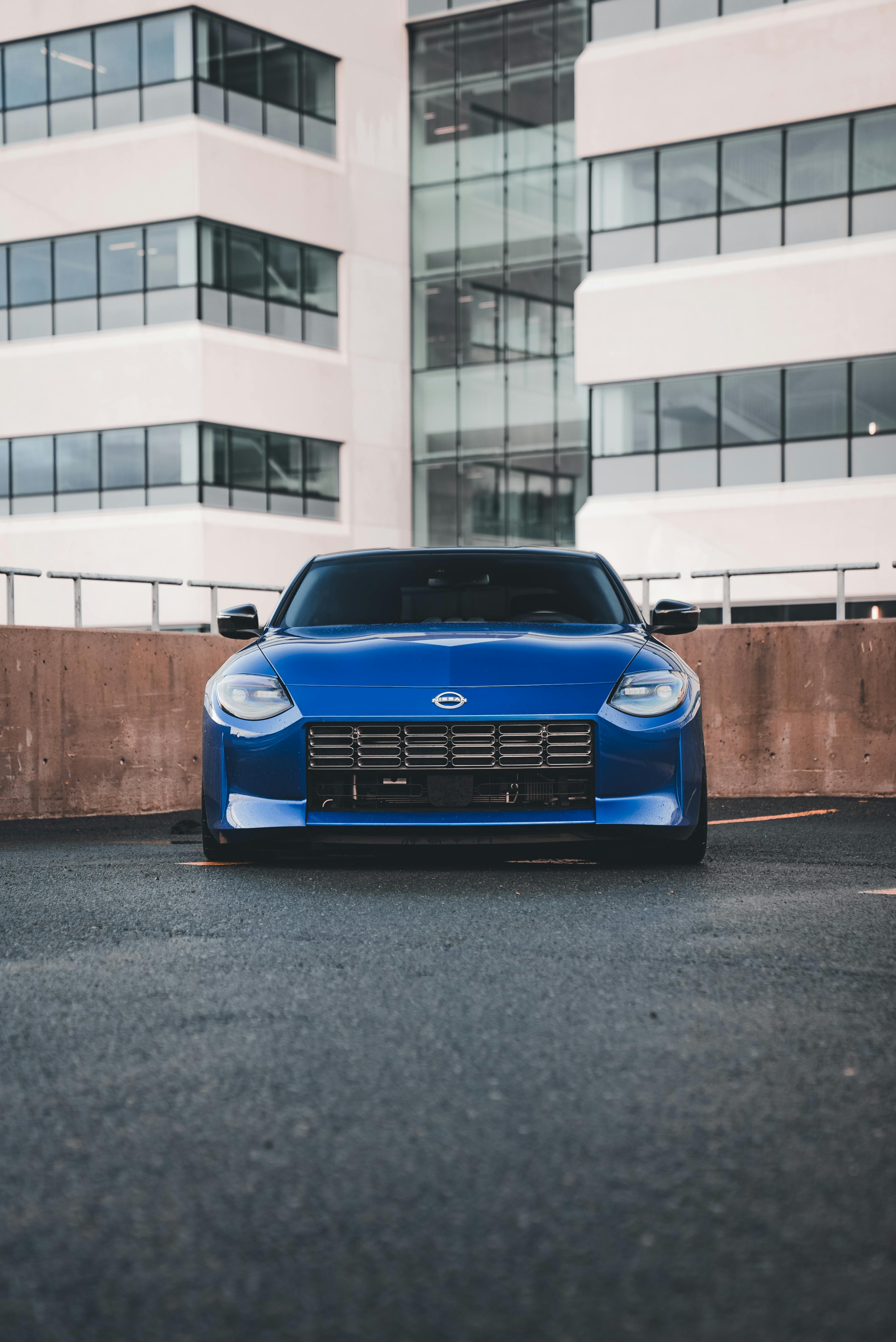 Blue Sports Car in Urban Setting · Free Stock Photo