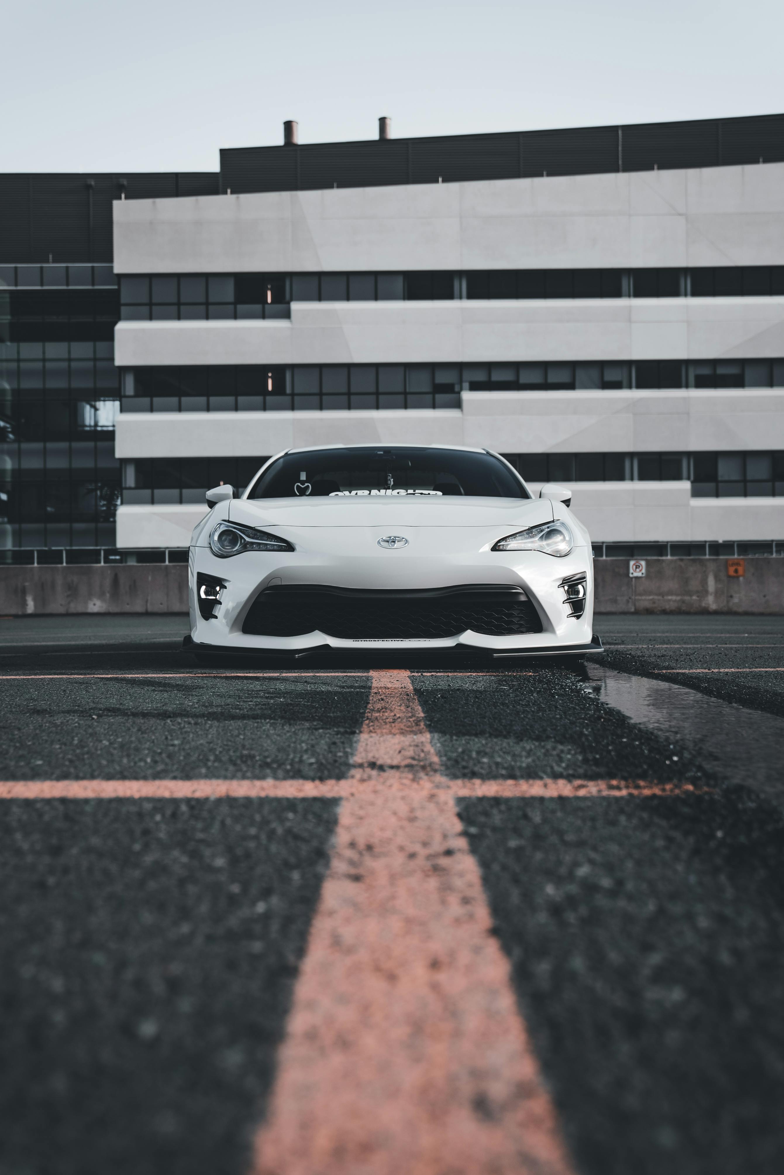 Front View of a White Sports Car on Asphalt · Free Stock Photo