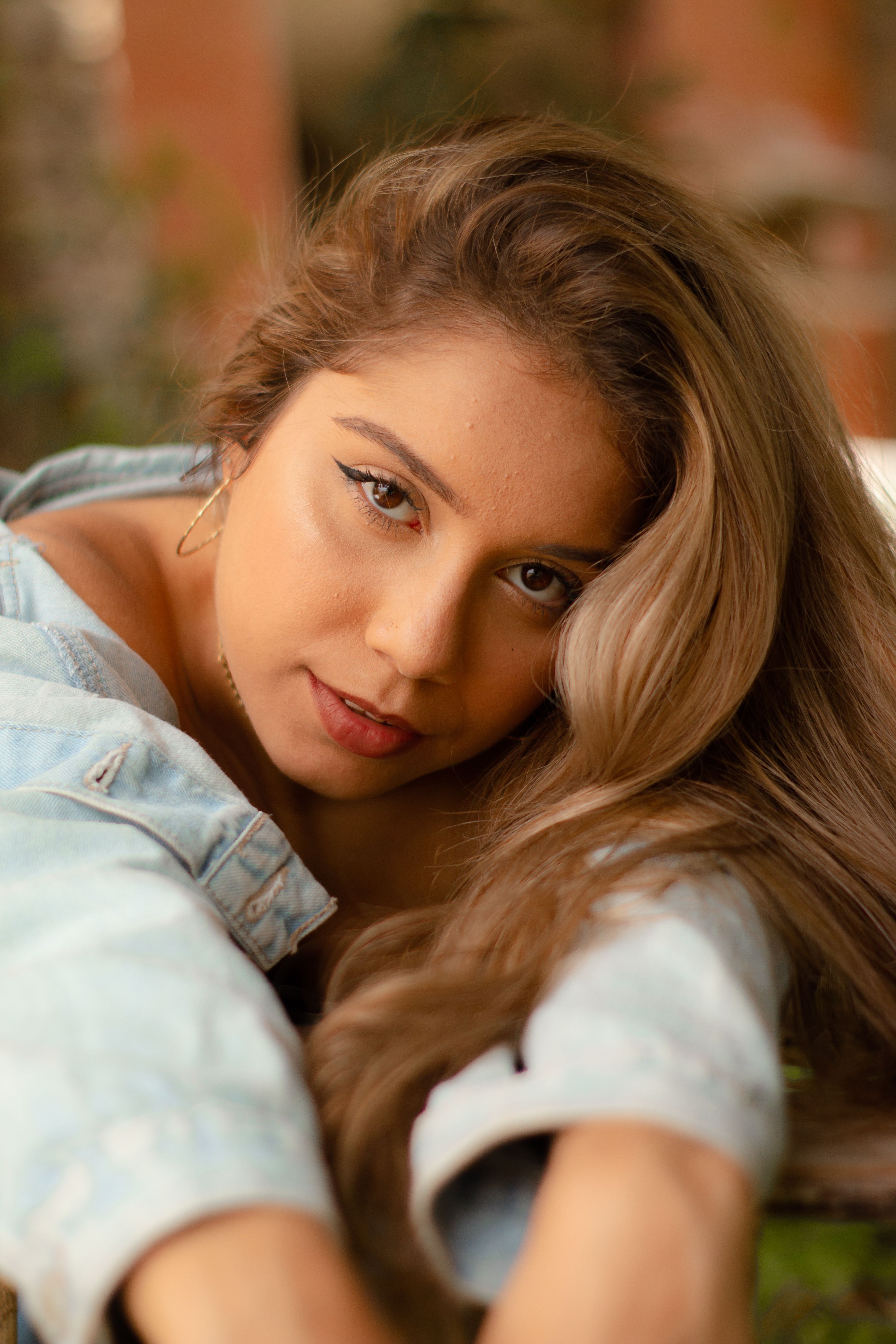 Warm Portrait of a Young Woman Outdoors · Free Stock Photo