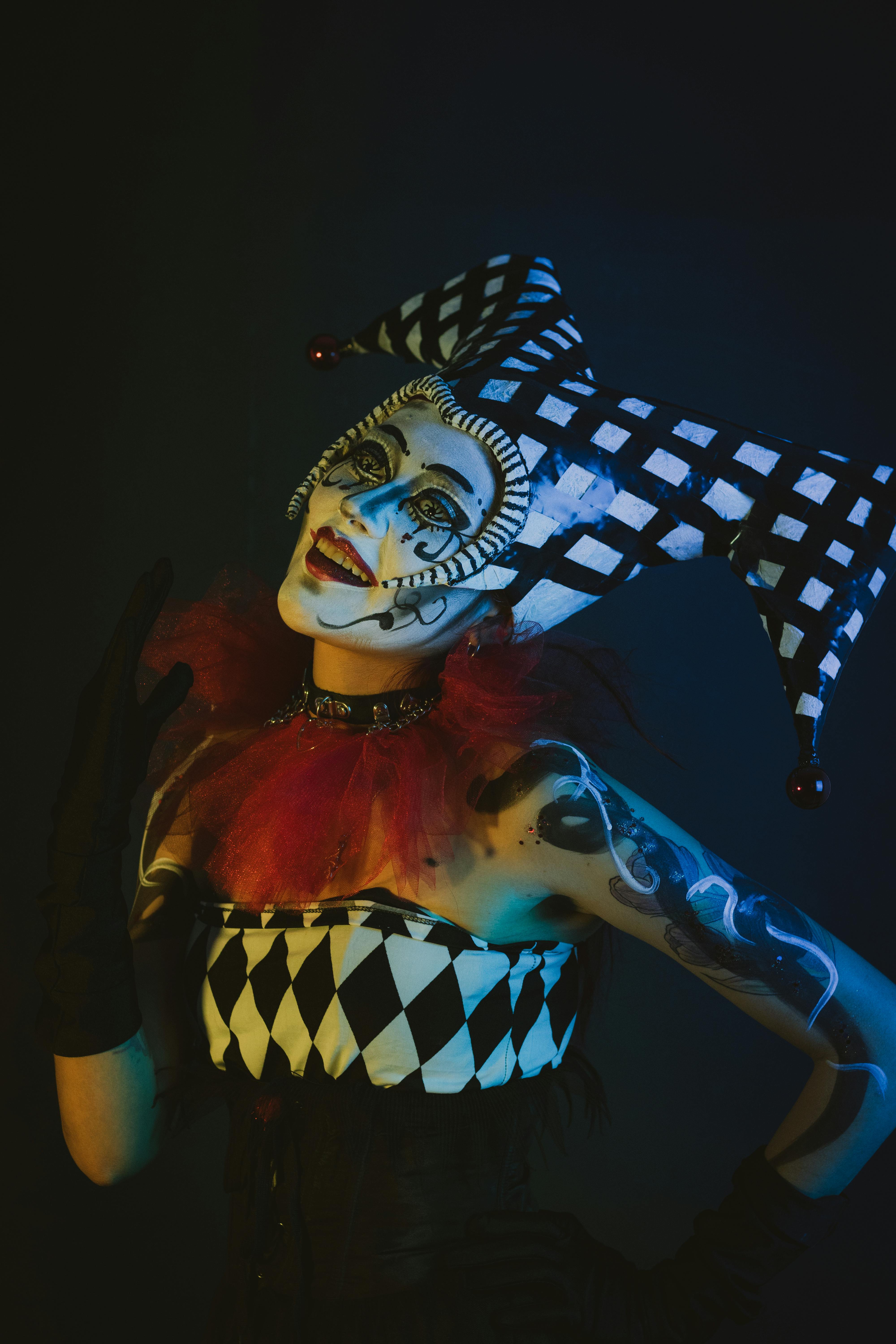 Creative Jester Costume in Dramatic Lighting · Free Stock Photo
