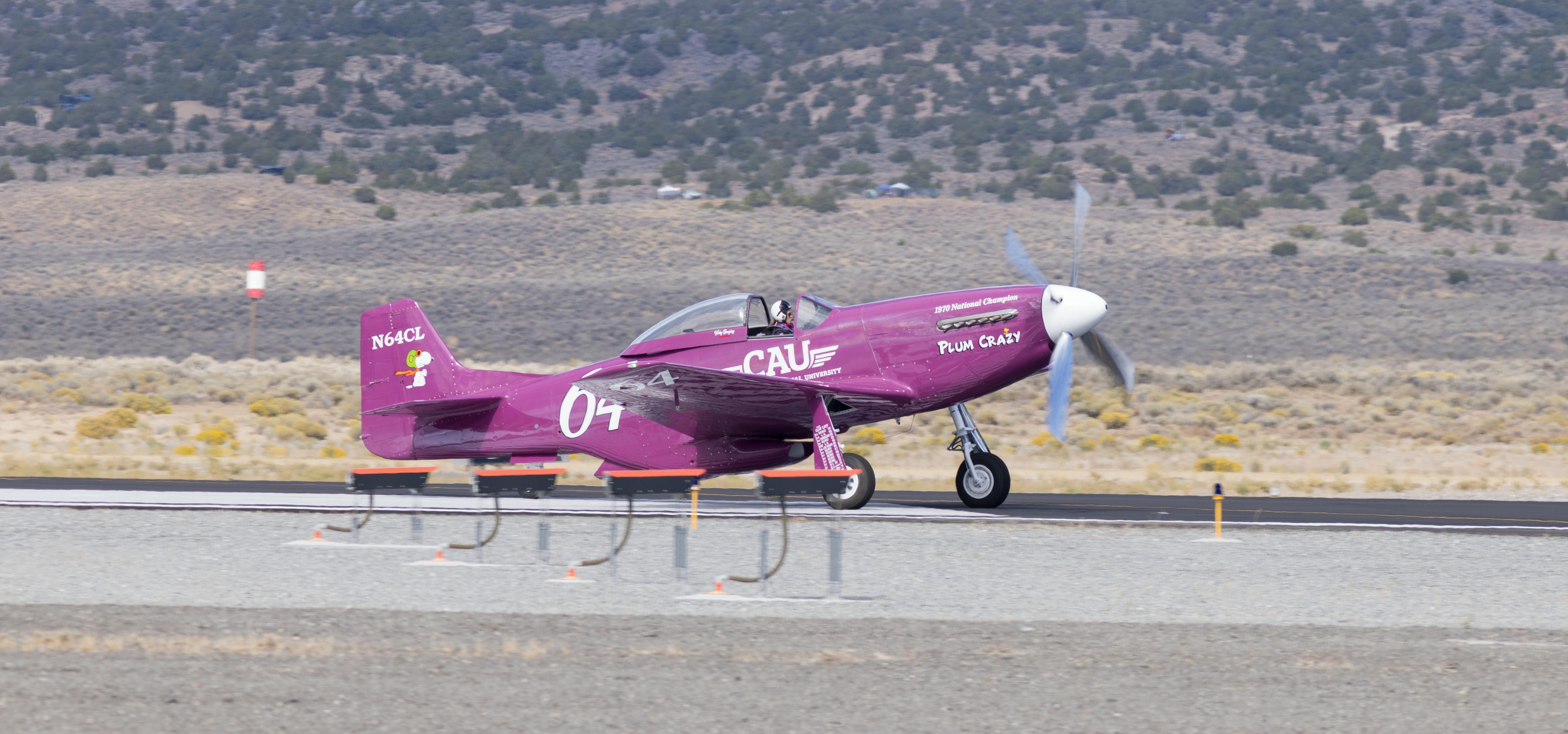 Vintage Racing Aircraft on Runway with Pilot · Free Stock Photo