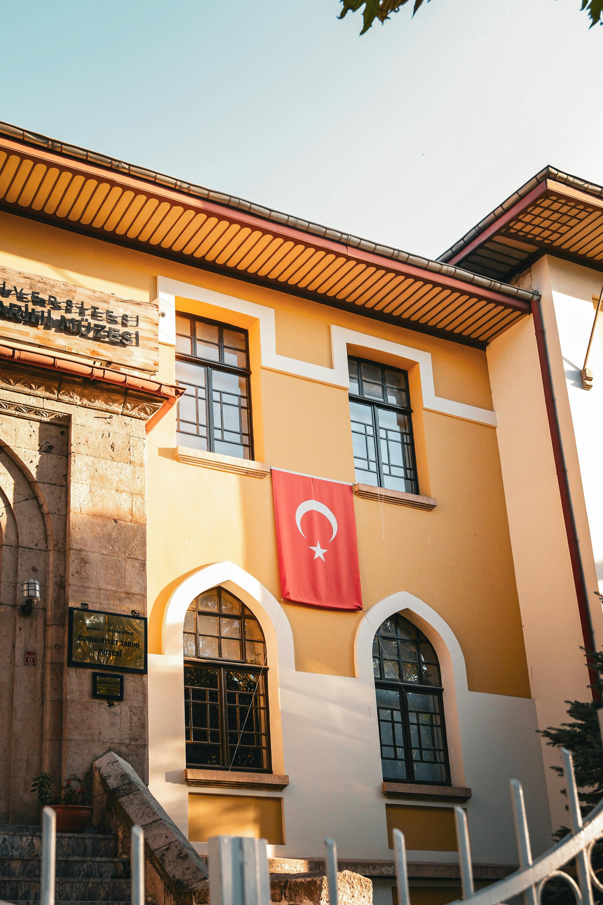 Historic Turkish Building with National Flag · Free Stock Photo