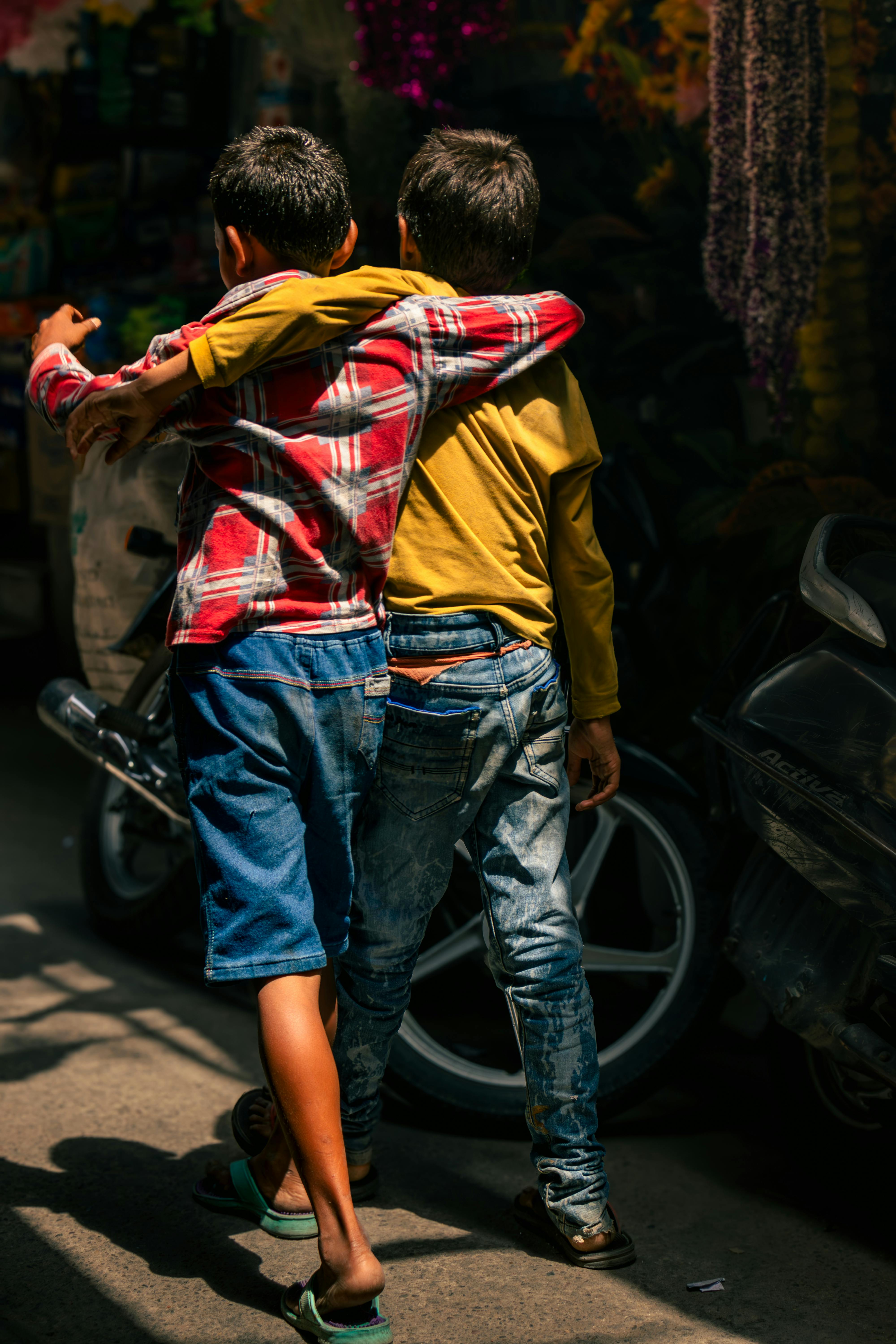 Boys Walking Together on a Sunny Indian Street · Free Stock Photo