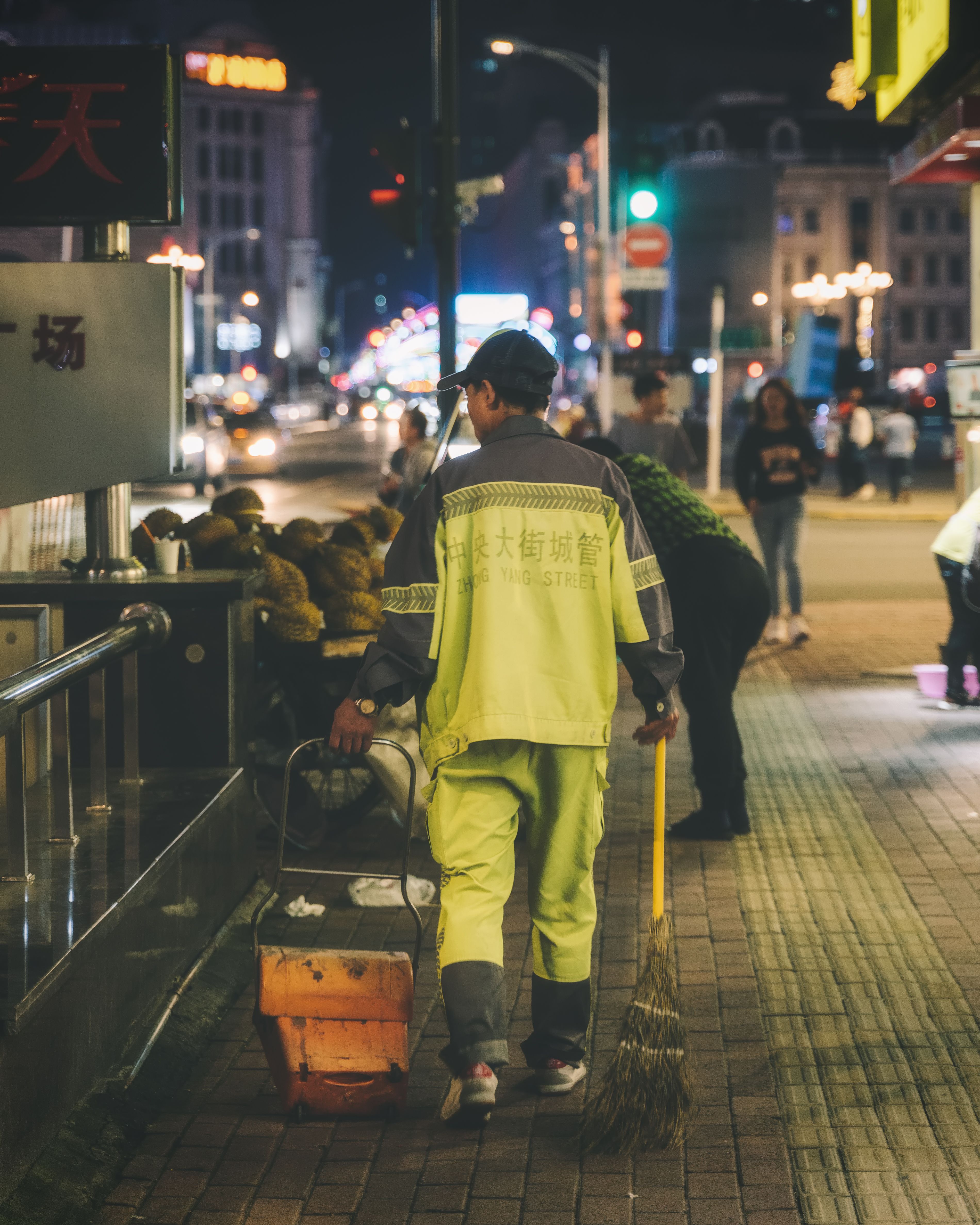 Photo of Person Sweeping the Sidewalk · Free Stock Photo