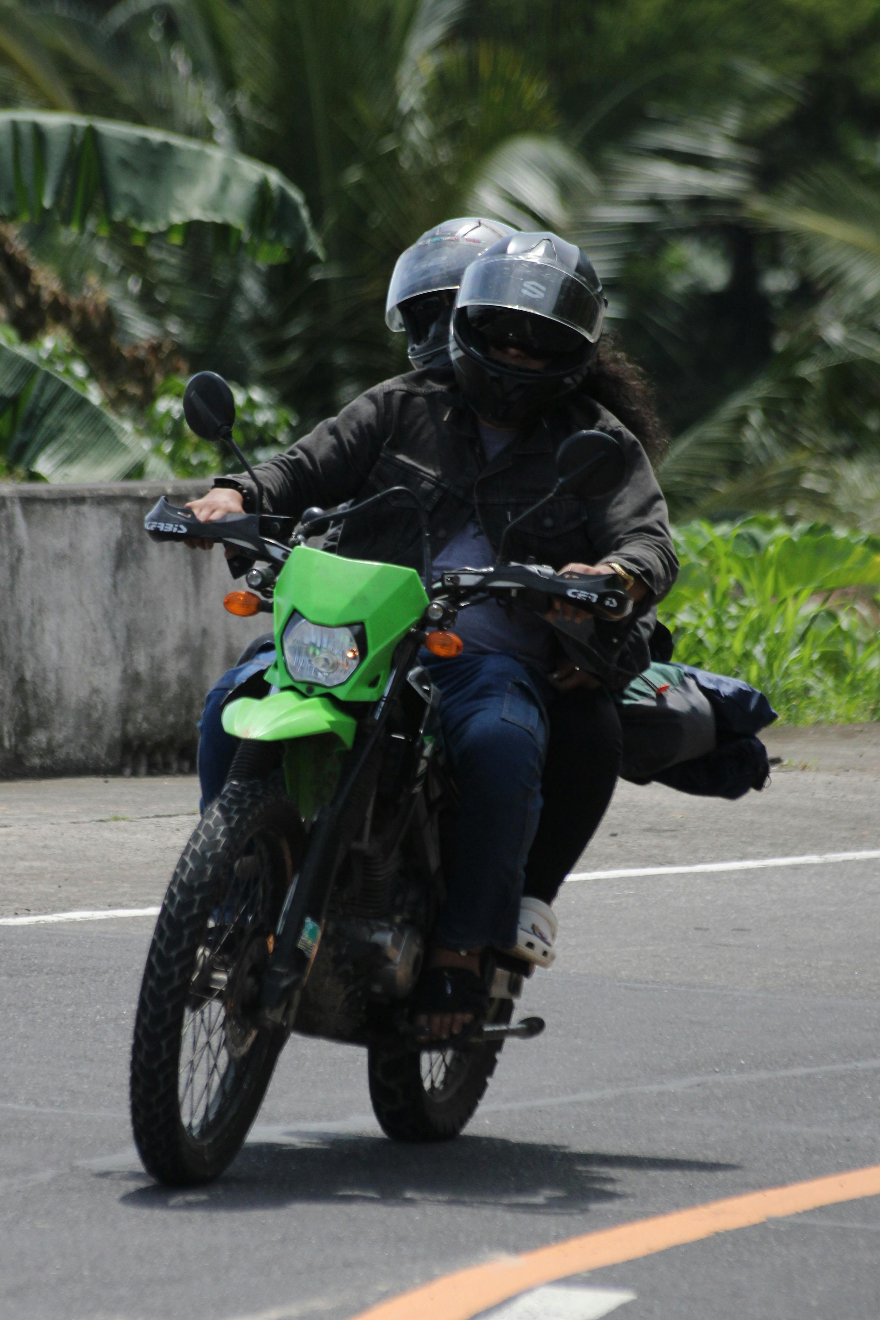 Adventurous Motorcycle Ride in Lush Greenery · Free Stock Photo