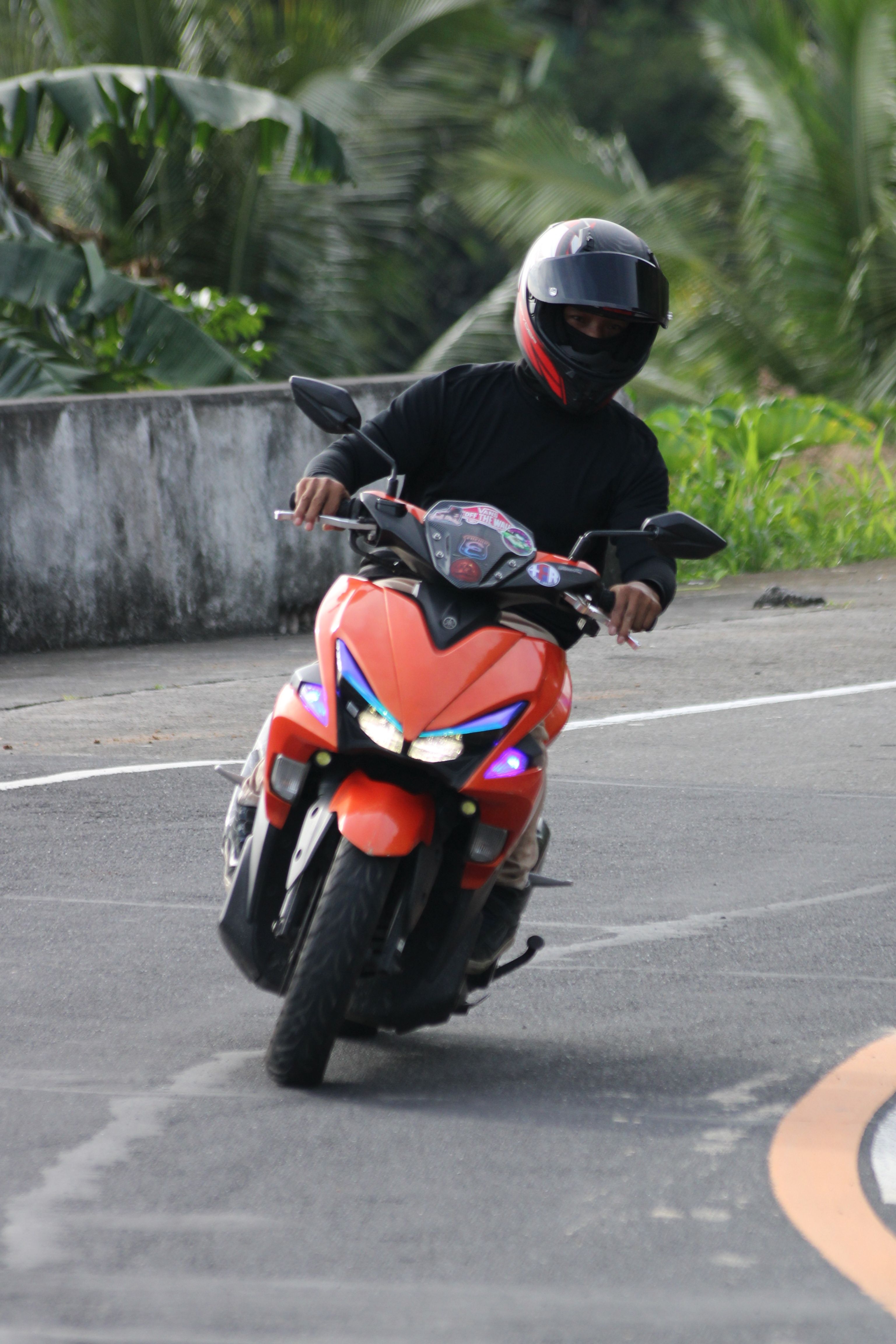 Motorcyclist on Orange Bike Taking a Sharp Turn · Free Stock Photo