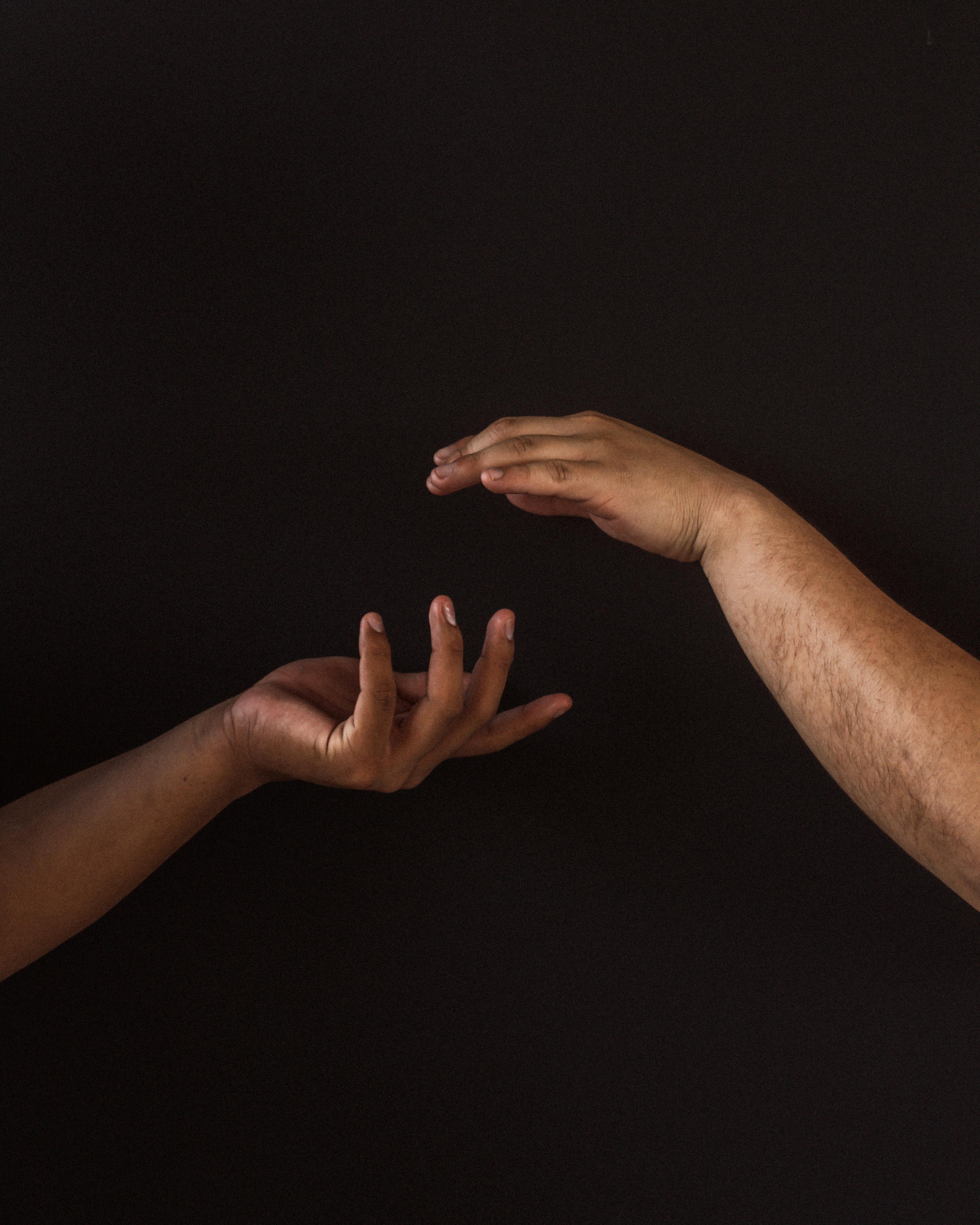 Man's Hand in Shallow Focus and Grayscale Photography · Free Stock Photo