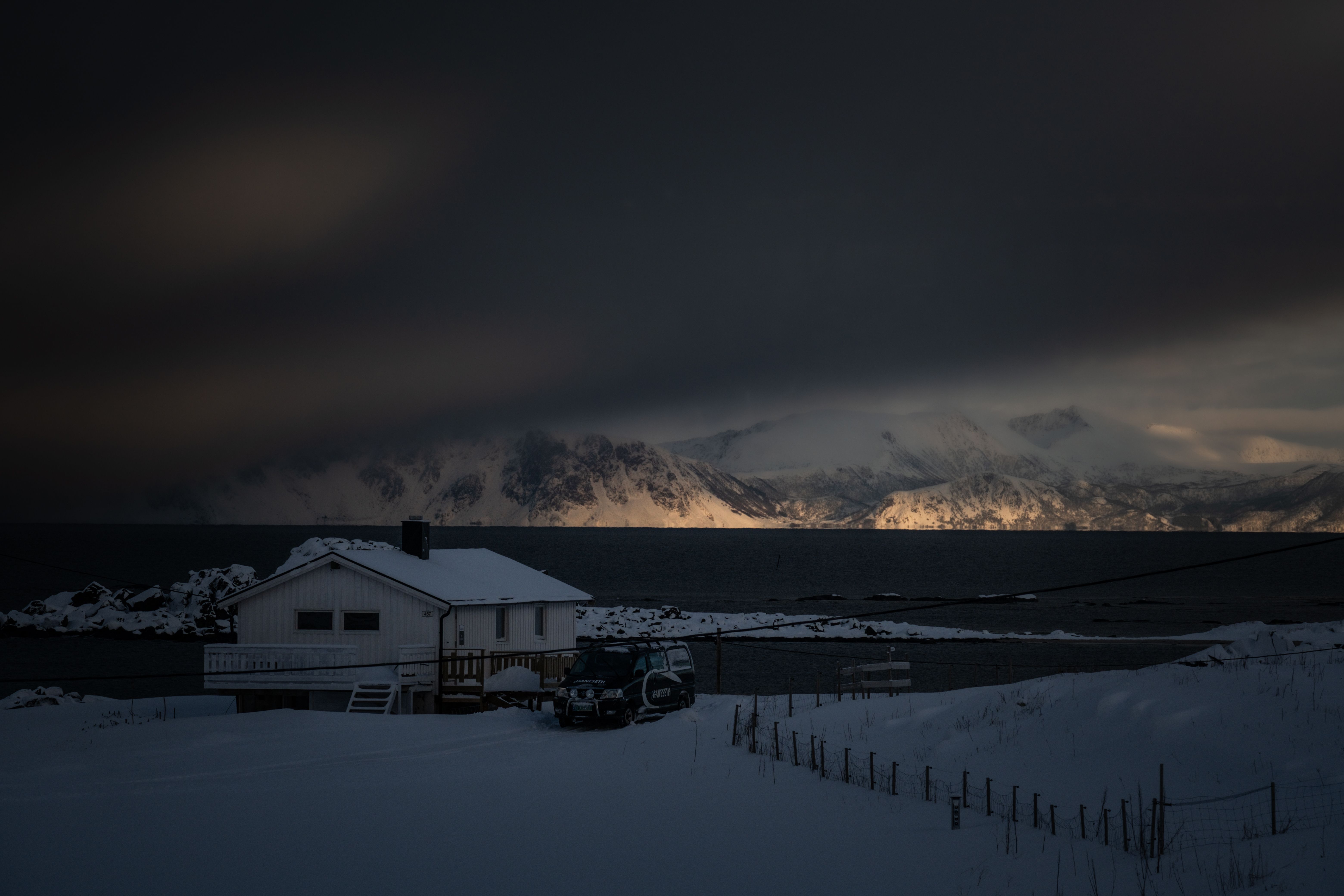 Snowy Coastal House with Dramatic Mountain View · Free Stock Photo