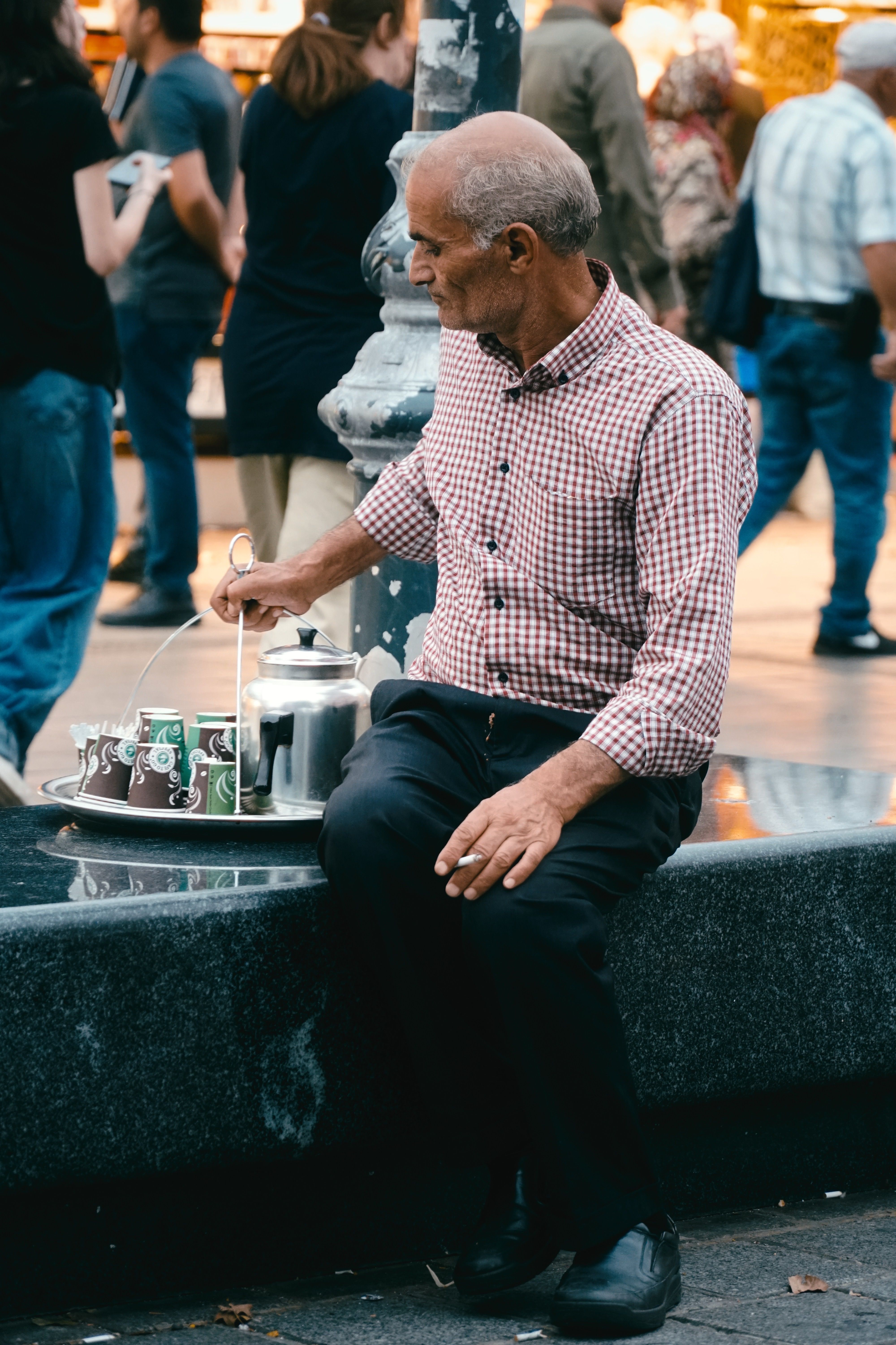 Street Vendor Serving Traditional Turkish Tea · Free Stock Photo