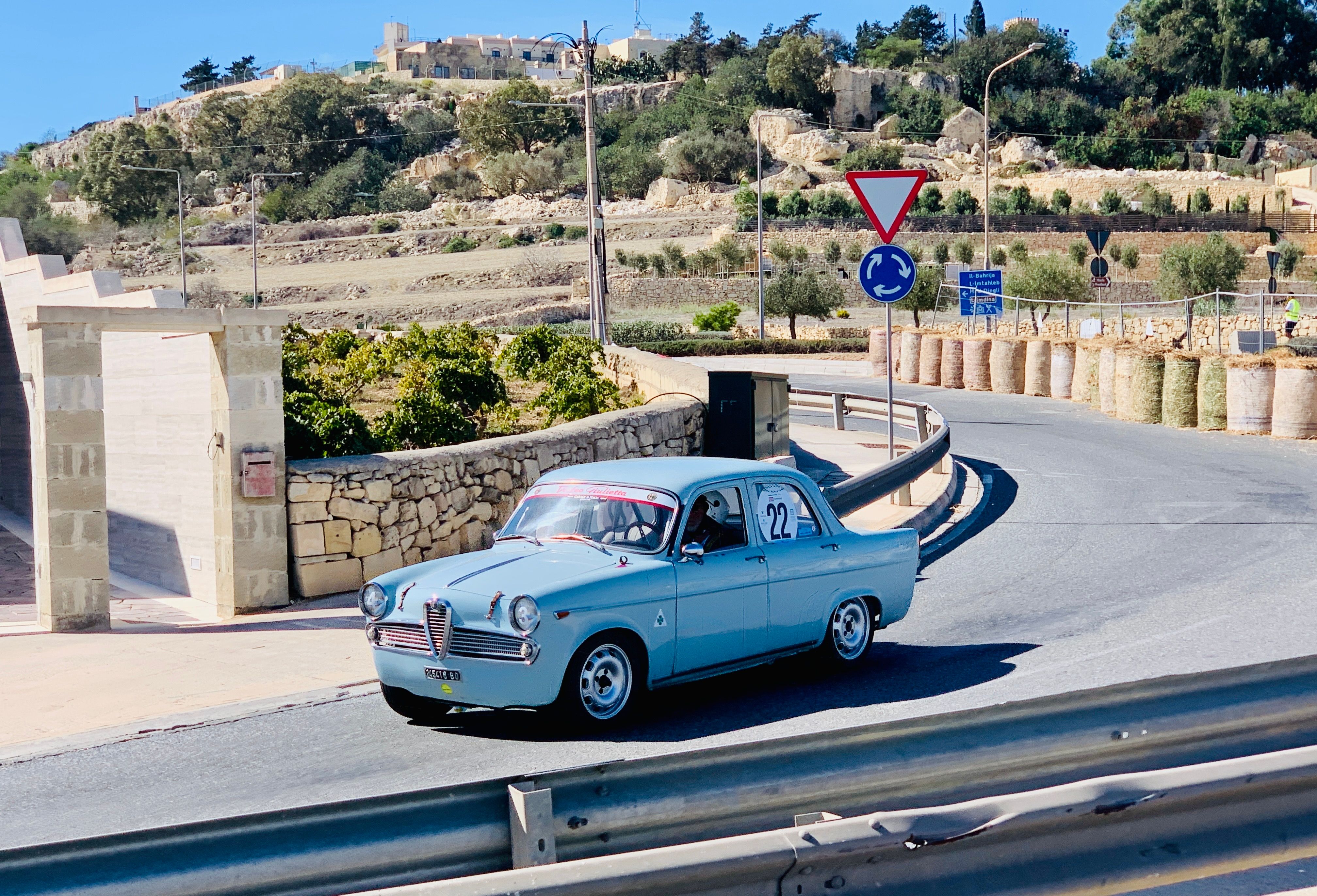Vintage Car Racing in Scenic Countryside · Free Stock Photo