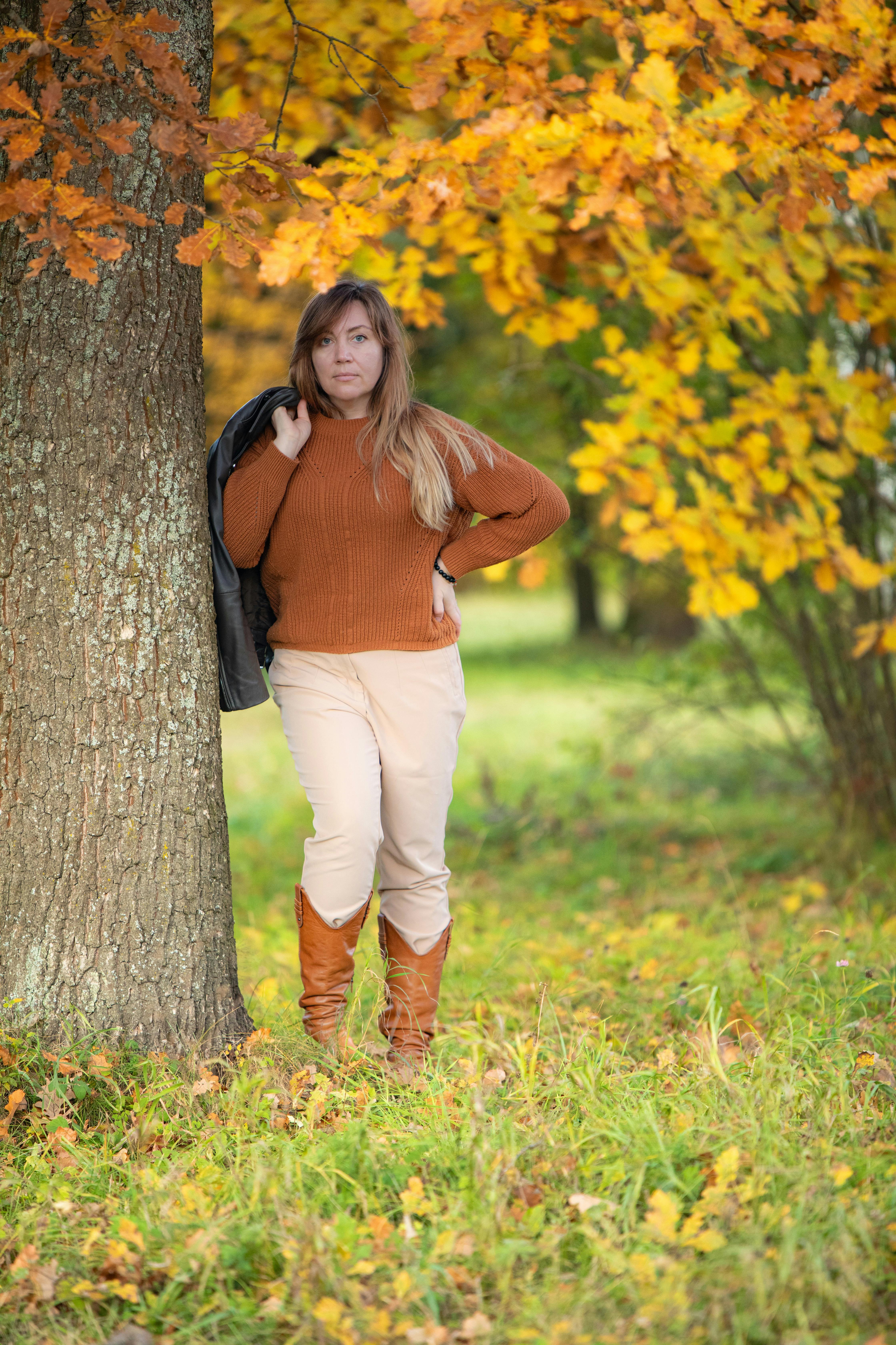 Young Woman Walking in Park in Autumn · Free Stock Photo