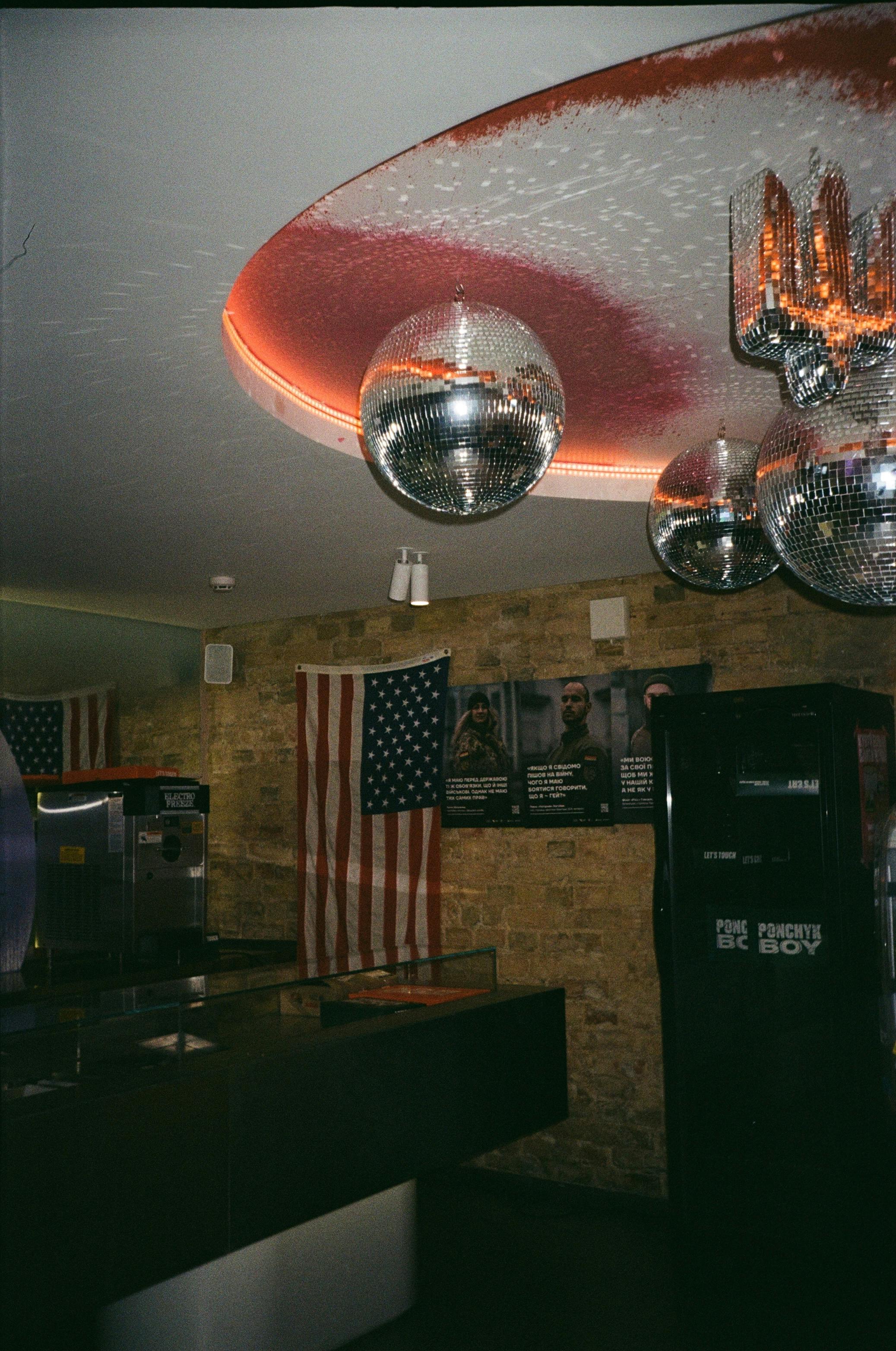 Nightclub Decor with US Flag and Disco Balls · Free Stock Photo
