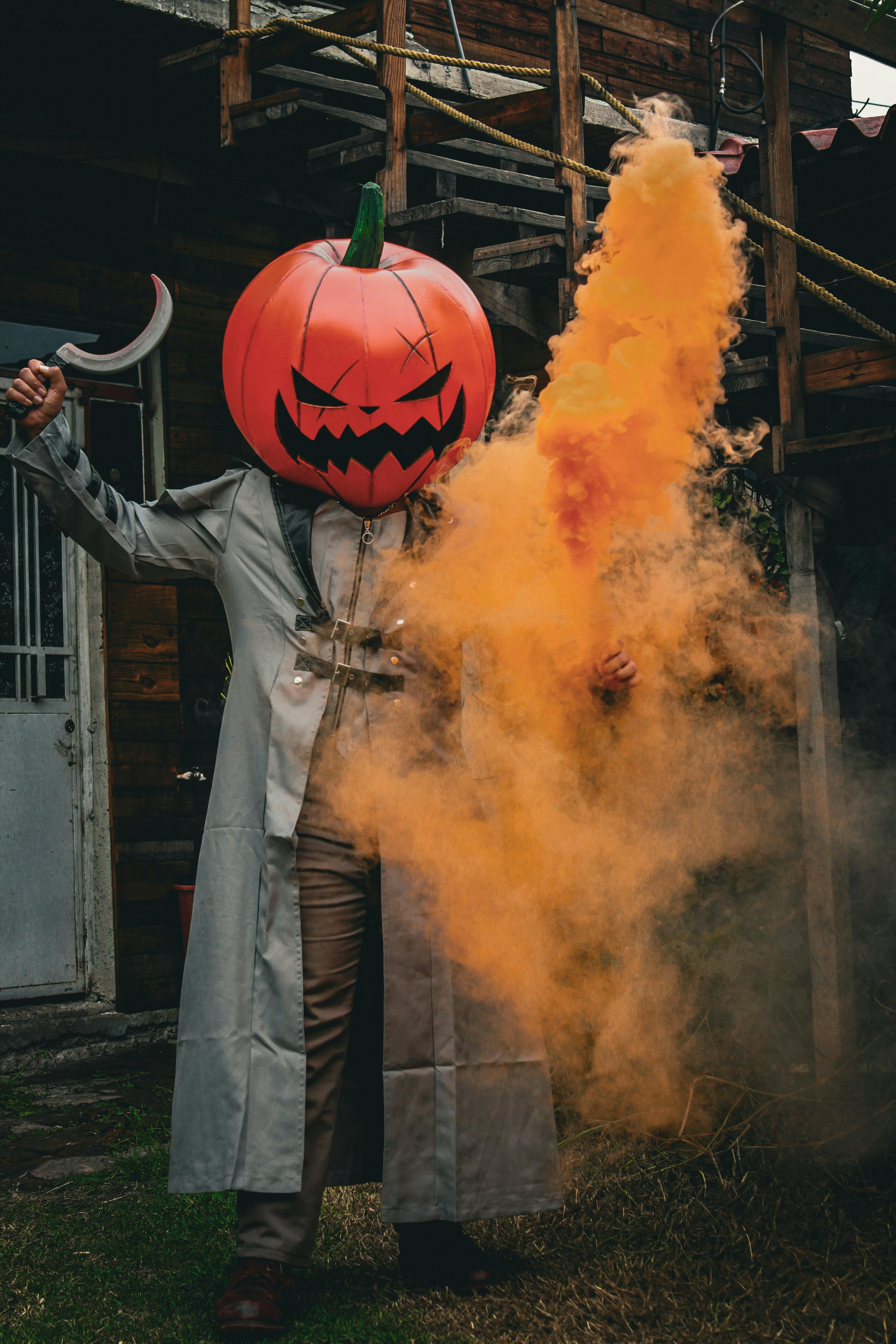 Spooky Halloween Pumpkin Head with Smoke Bomb · Free Stock Photo