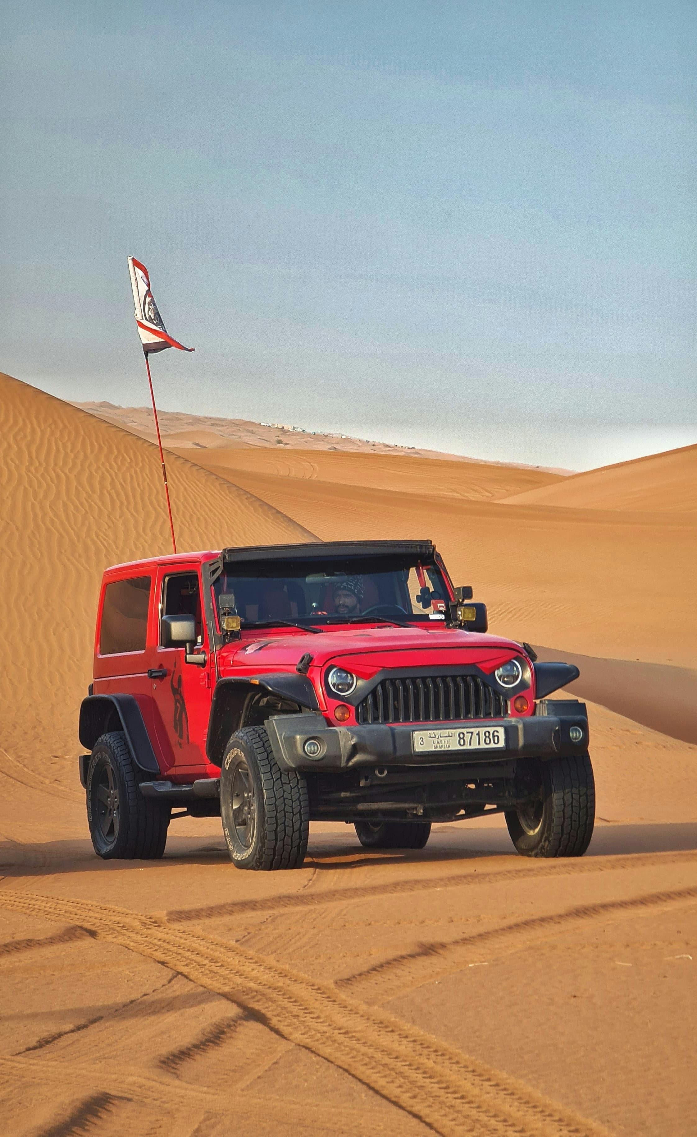 Off-Road Red SUV in Sharjah Desert · Free Stock Photo