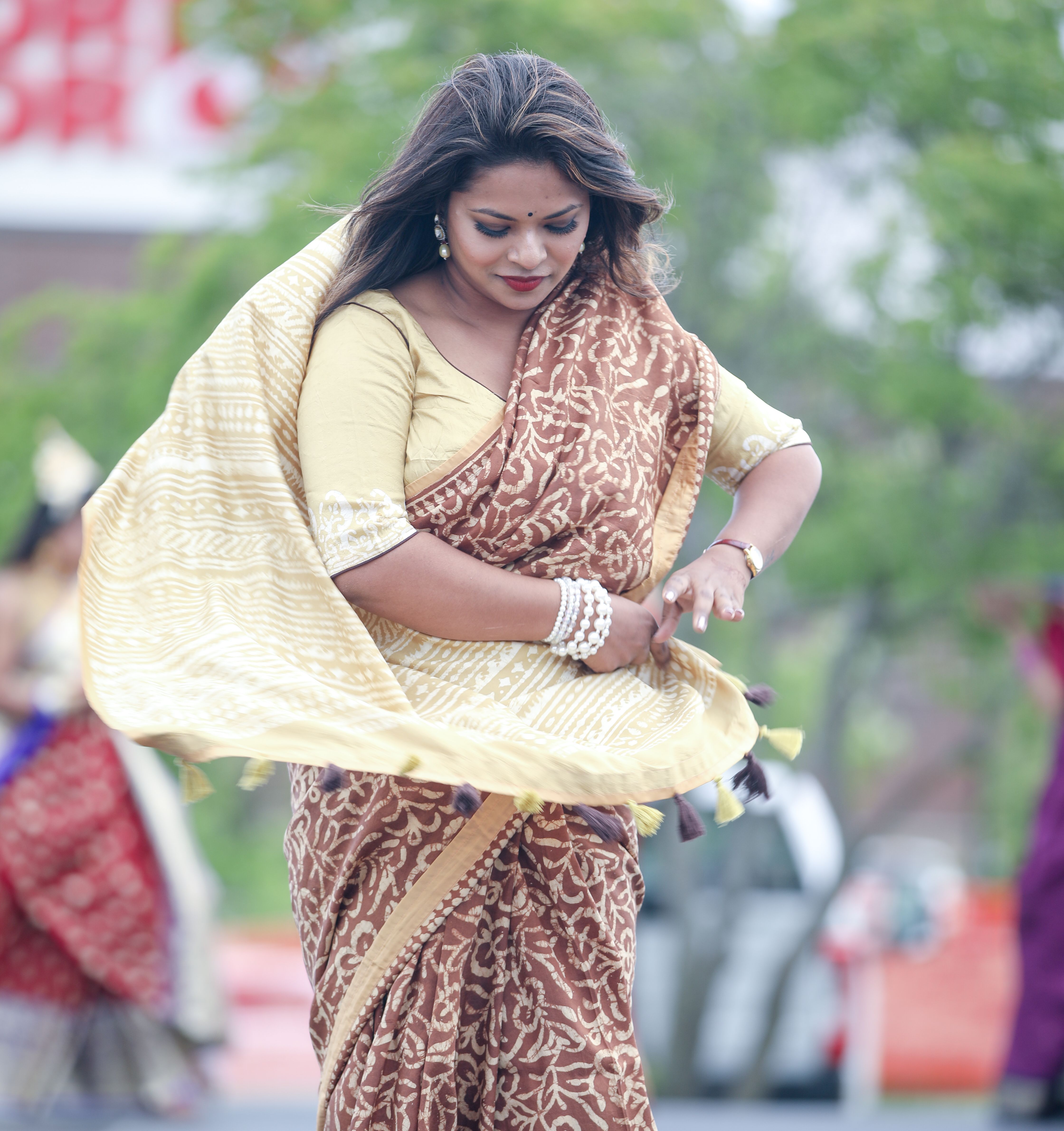 Woman in Traditional Sari in Outdoor Setting · Free Stock Photo