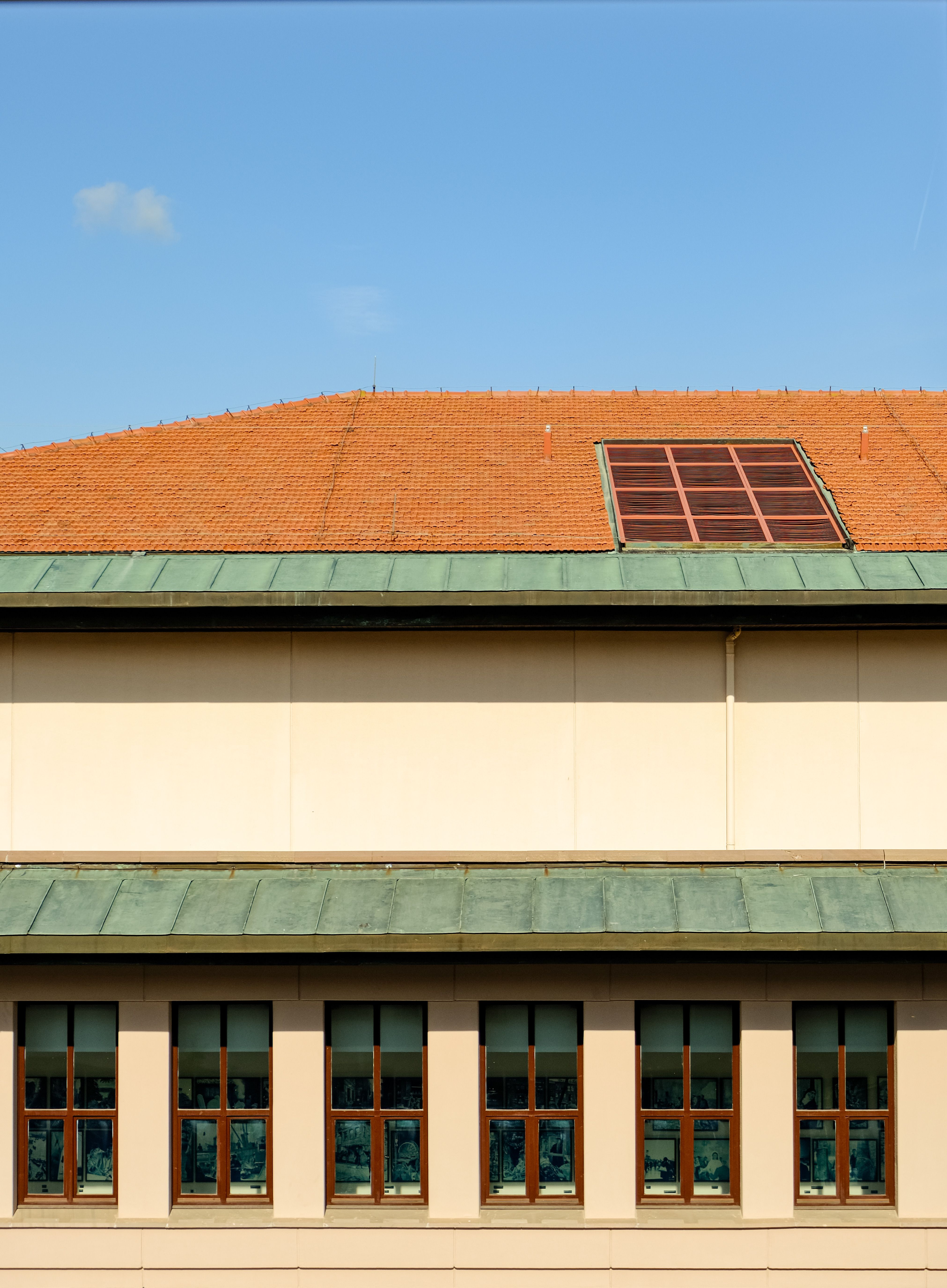 Modern Building Facade with Red Tiled Roof · Free Stock Photo