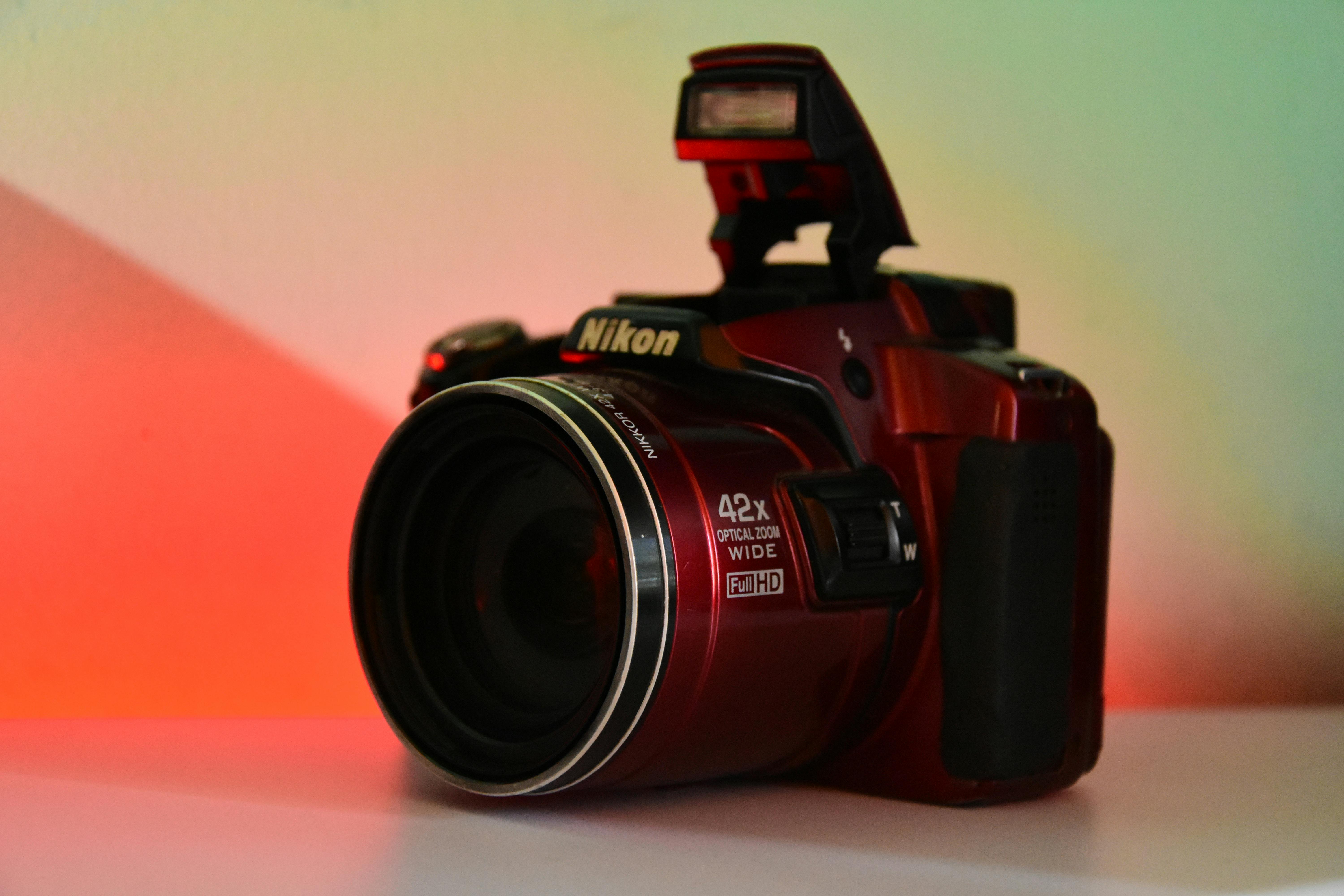 Red Digital Camera with Pop-Up Flash in Studio Lighting · Free Stock Photo
