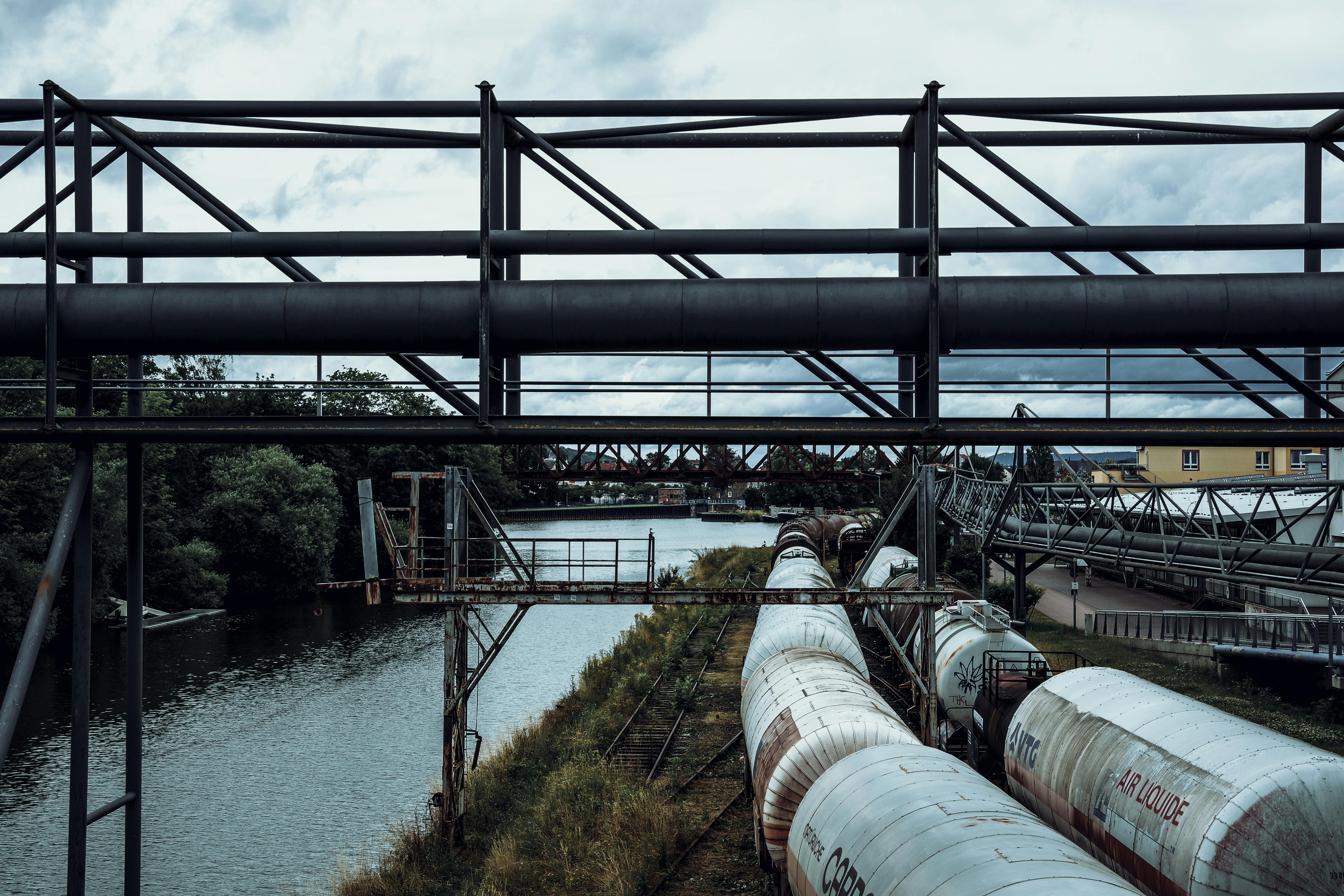 Industrial Railway and Pipe Infrastructure Landscape · Free Stock Photo