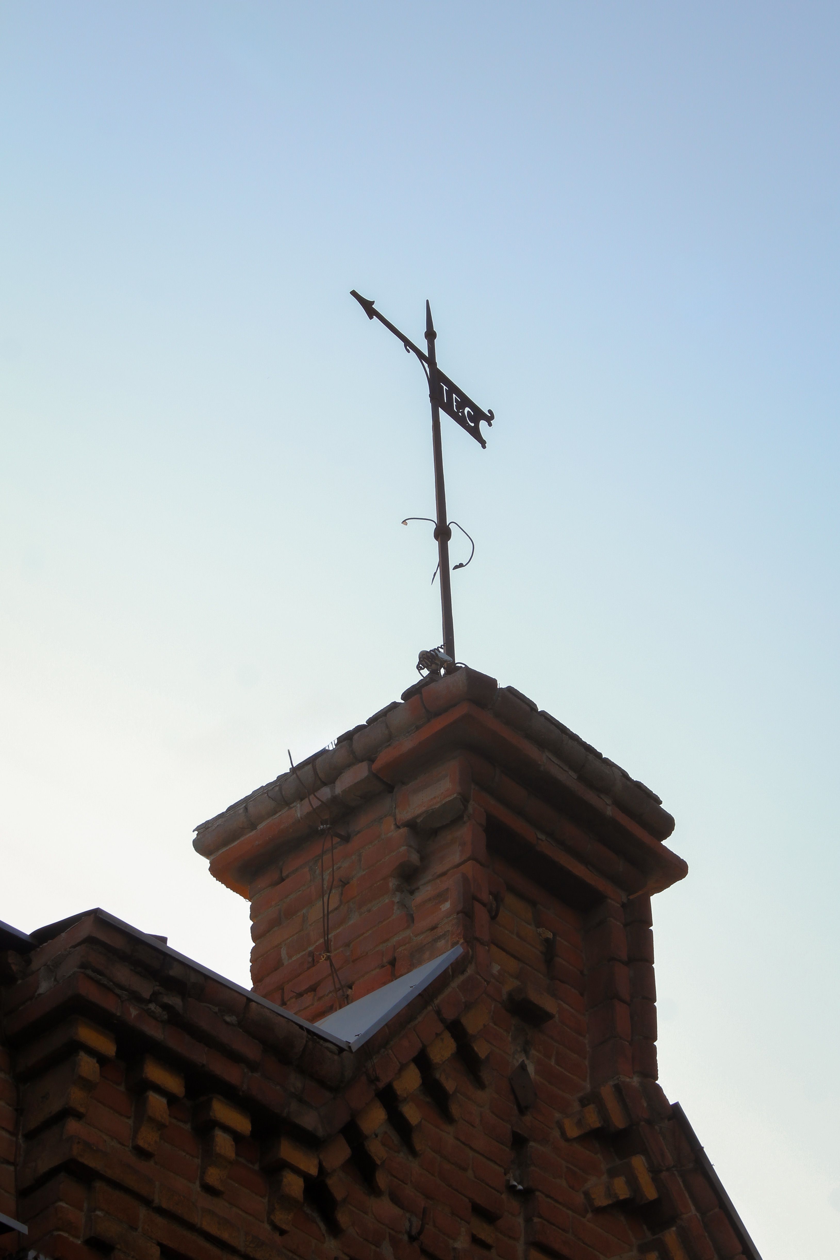 Historic Brick Chimney with Weather Vane in Tbilisi · Free Stock Photo