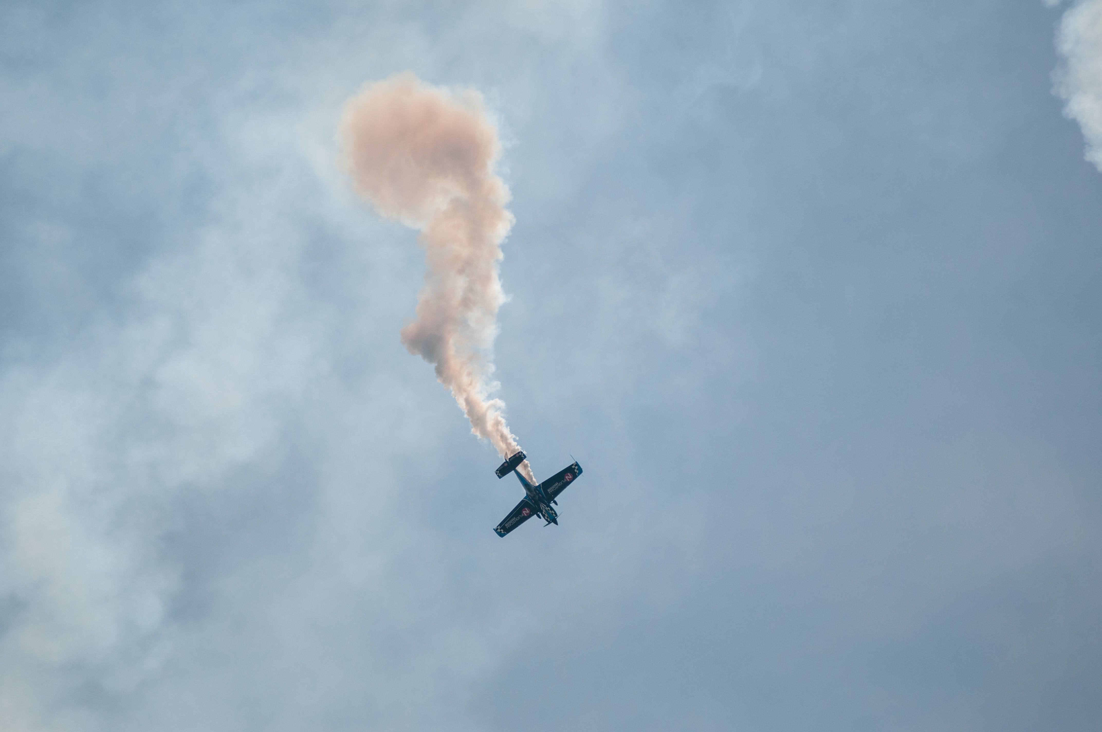 Aerobatic Airplane Performing Smoke Trail Stunt · Free Stock Photo