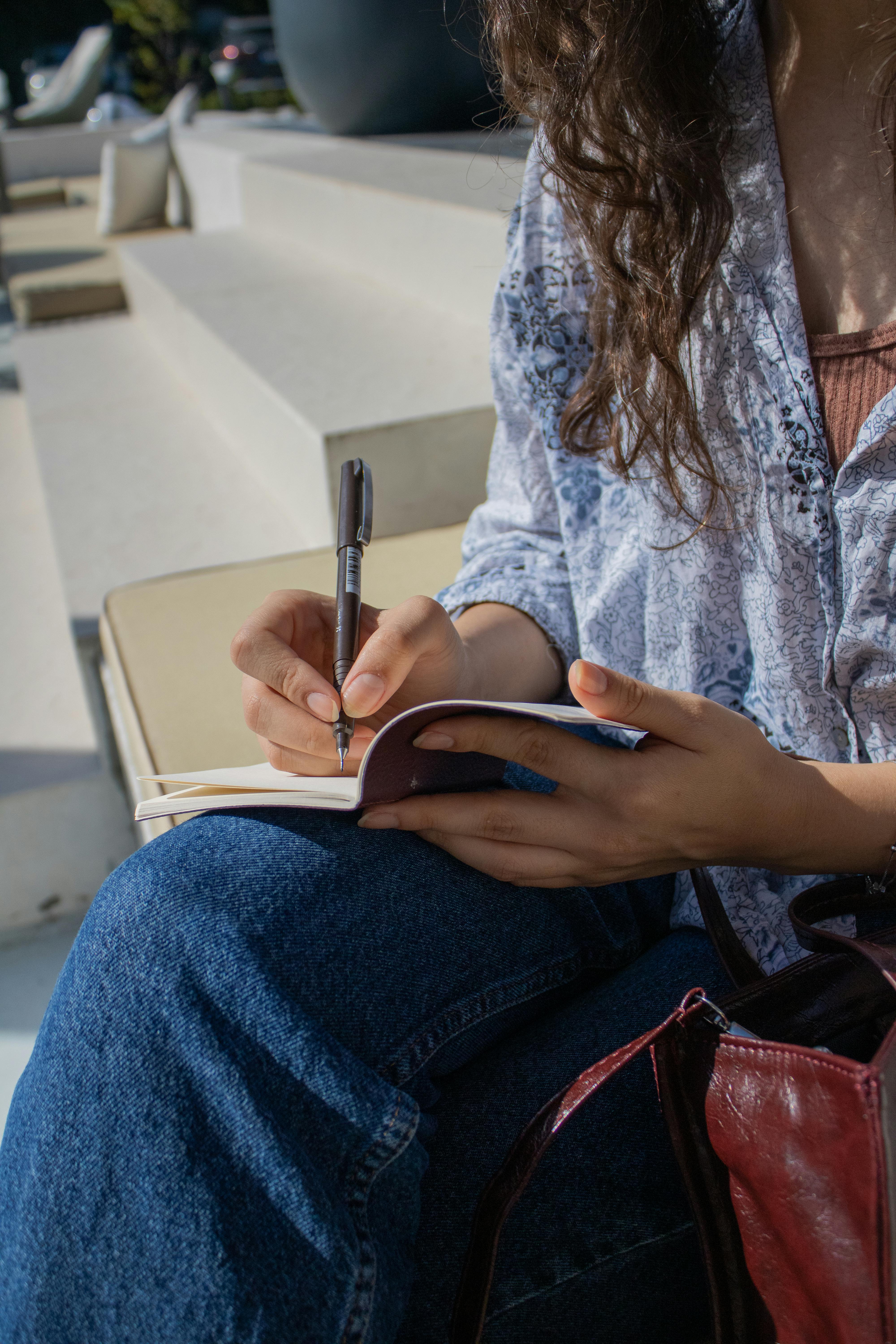 Young Woman Journaling Outdoors in Istanbul · Free Stock Photo