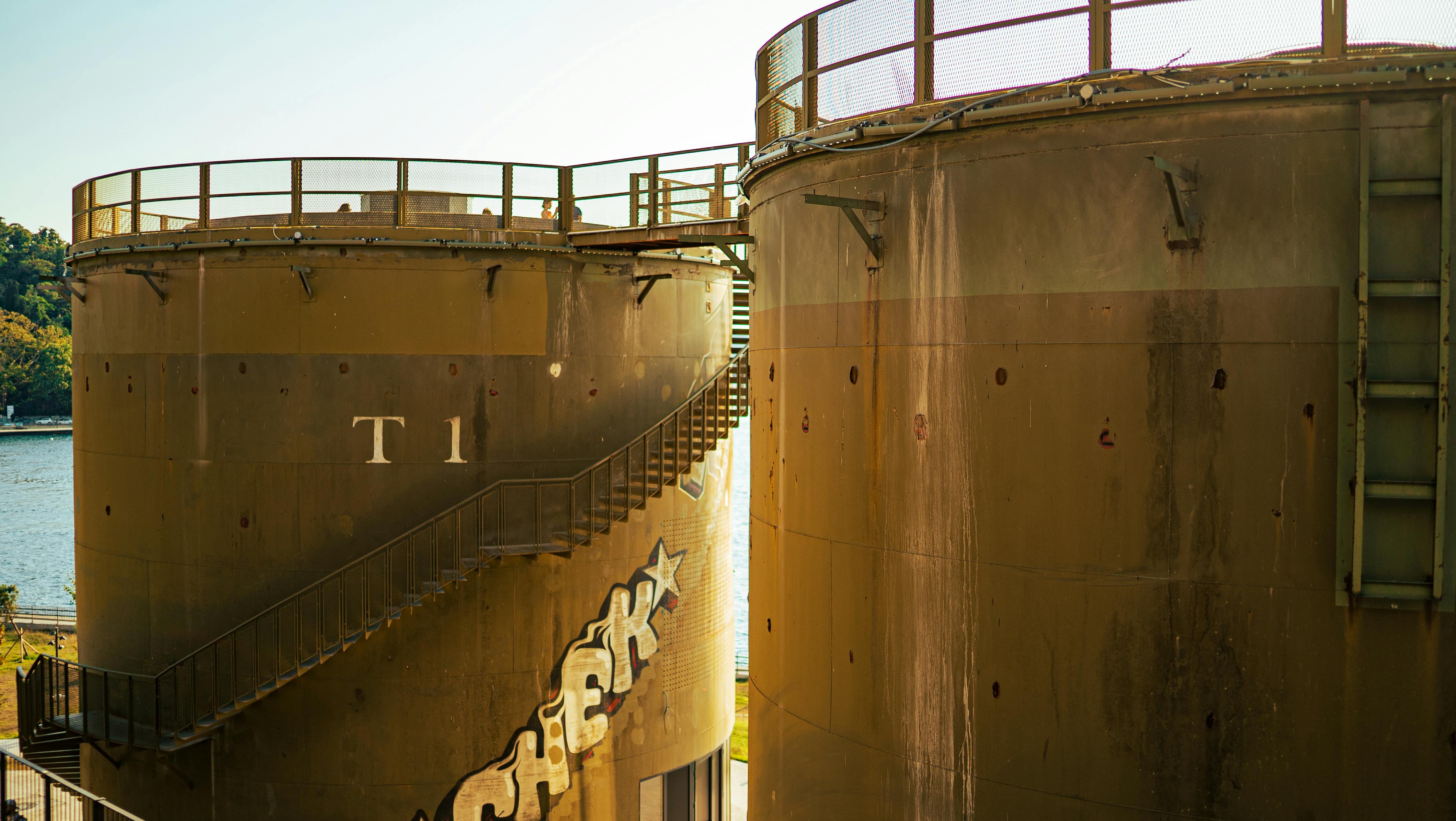 Industrial Storage Tanks in Sunlight · Free Stock Photo