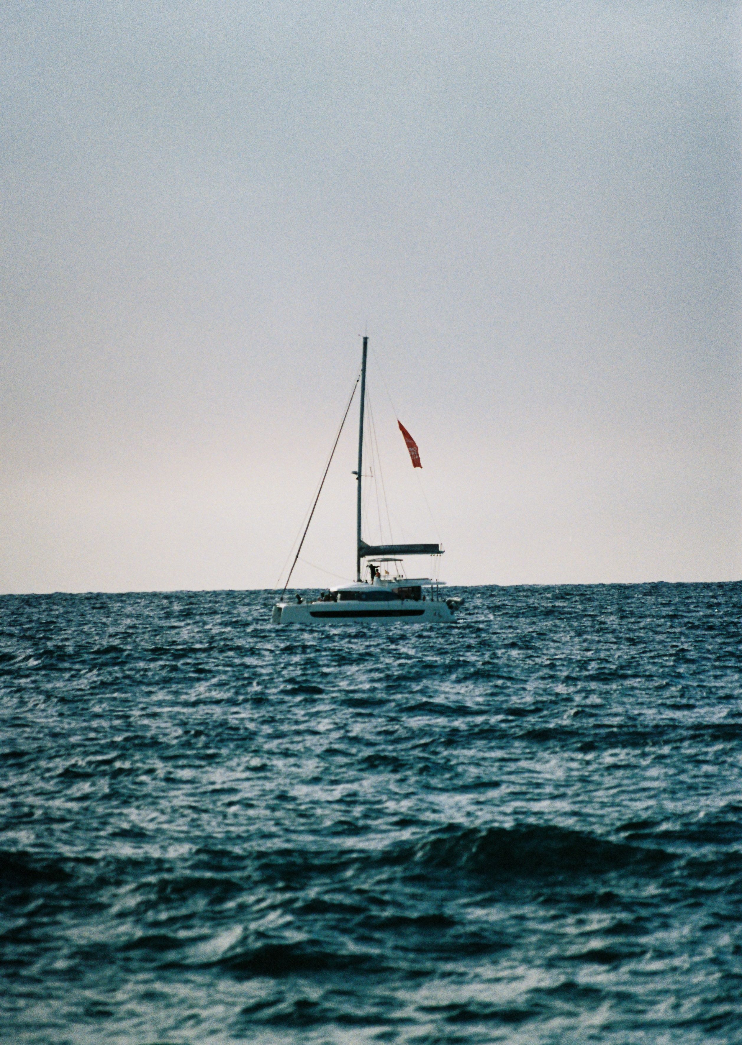Sailing Yacht on Ibiza's Tranquil Waters · Free Stock Photo