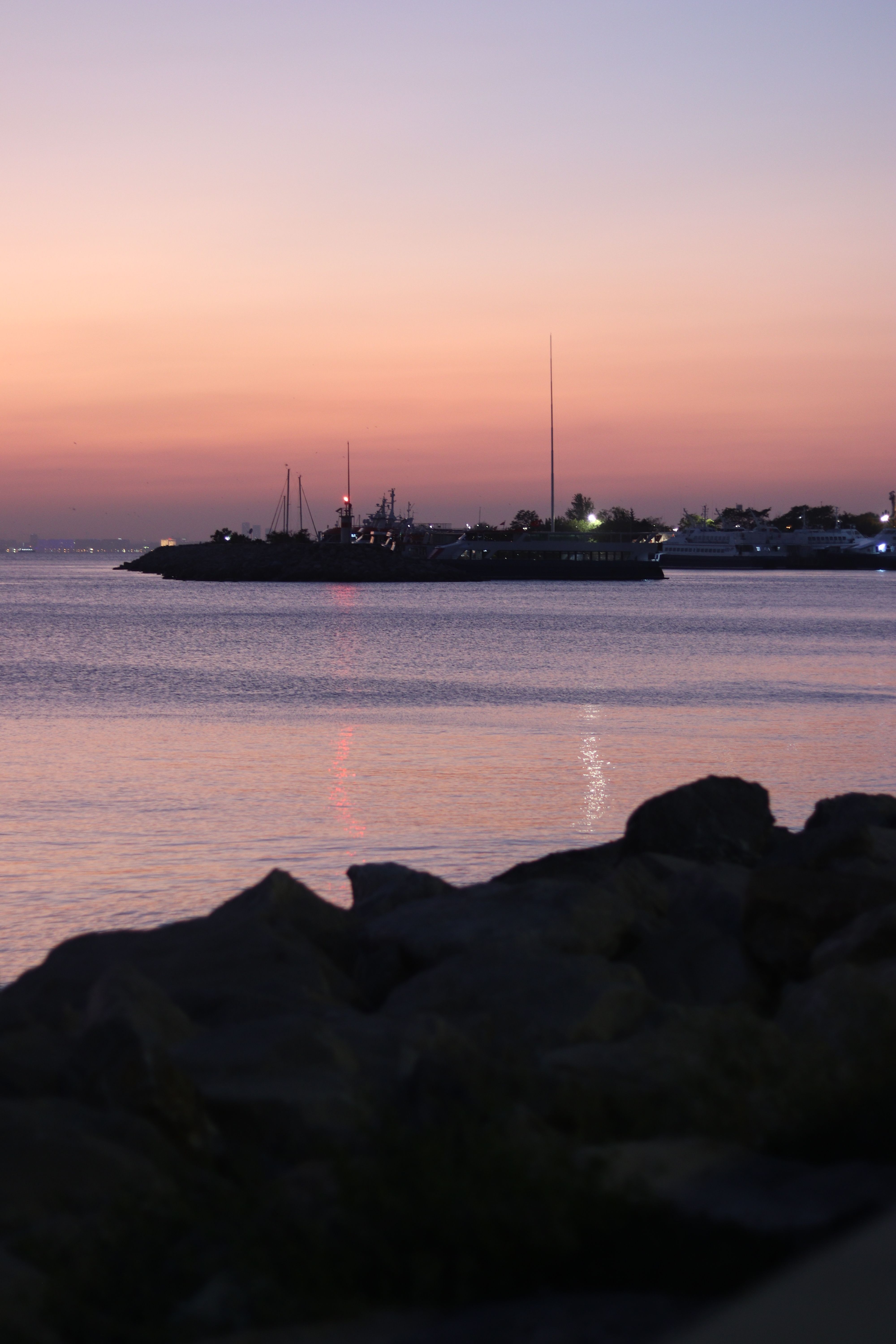 Tranquil Harbor at Sunset with Silhouetted Ships · Free Stock Photo