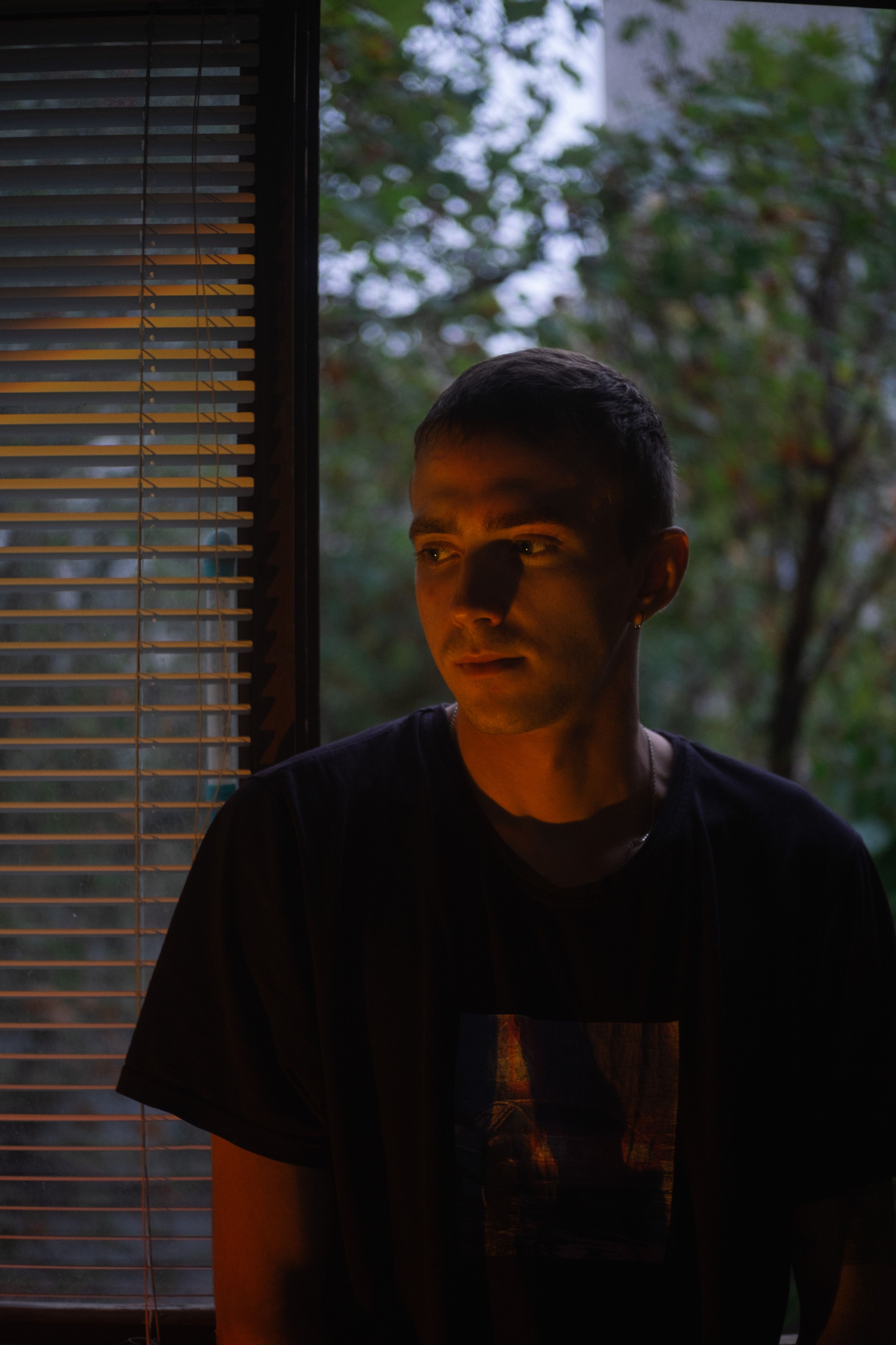 Moody Portrait of a Young Man by Window · Free Stock Photo