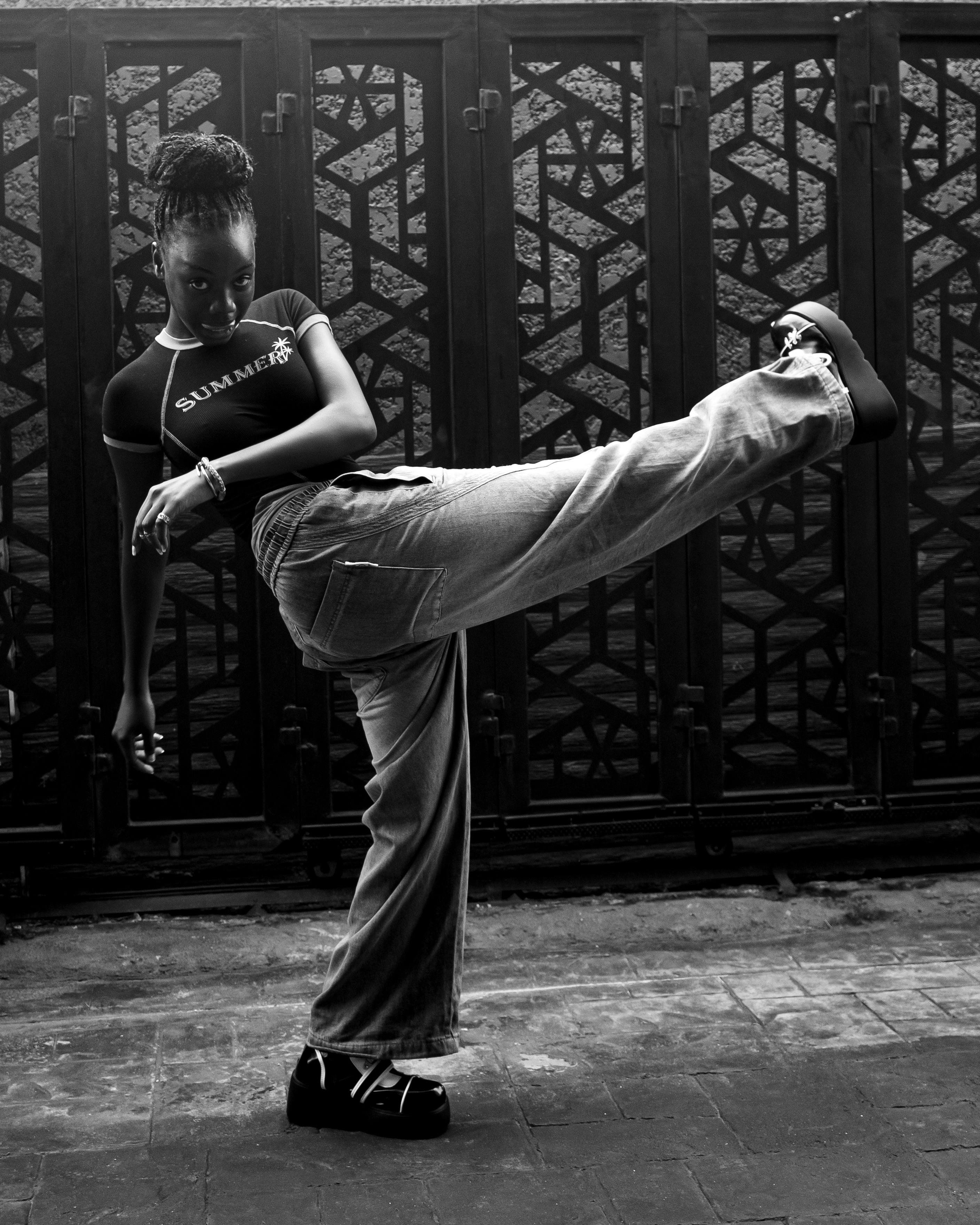 Dynamic Dance Pose in Urban Setting · Free Stock Photo