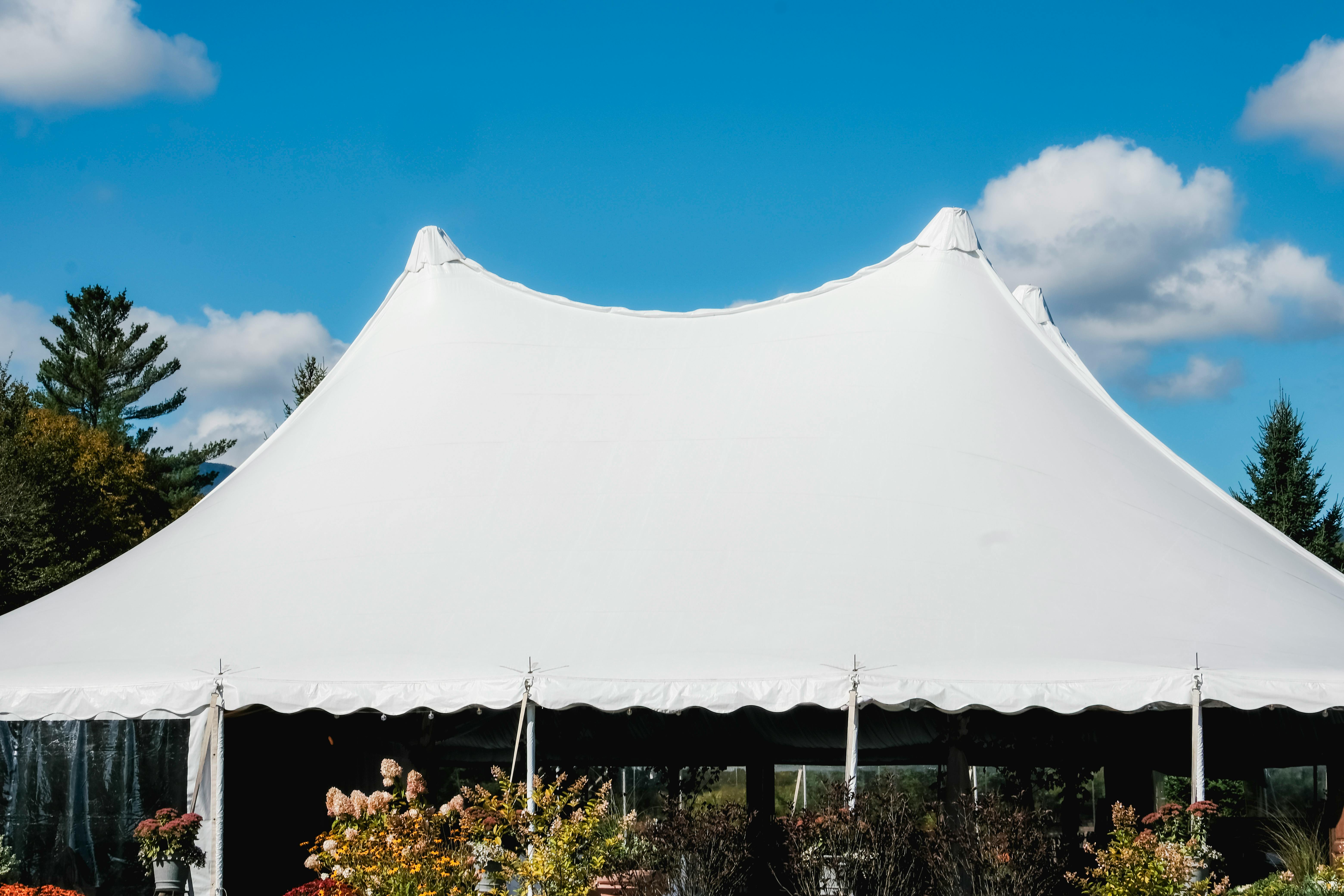 Elegant White Event Tent against Blue Sky · Free Stock Photo