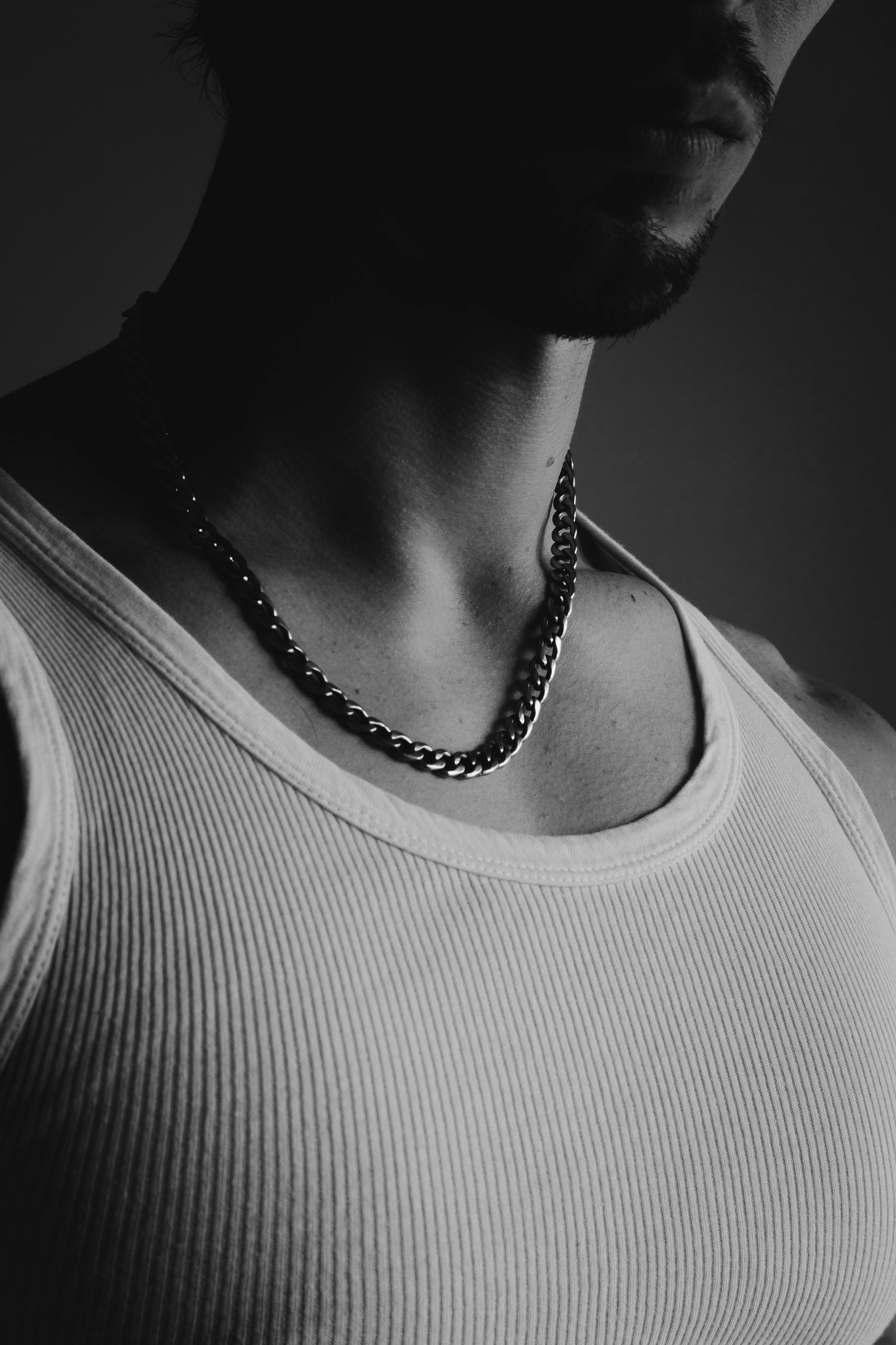 Black and White Close-Up of Man in Chain Necklace · Free Stock Photo