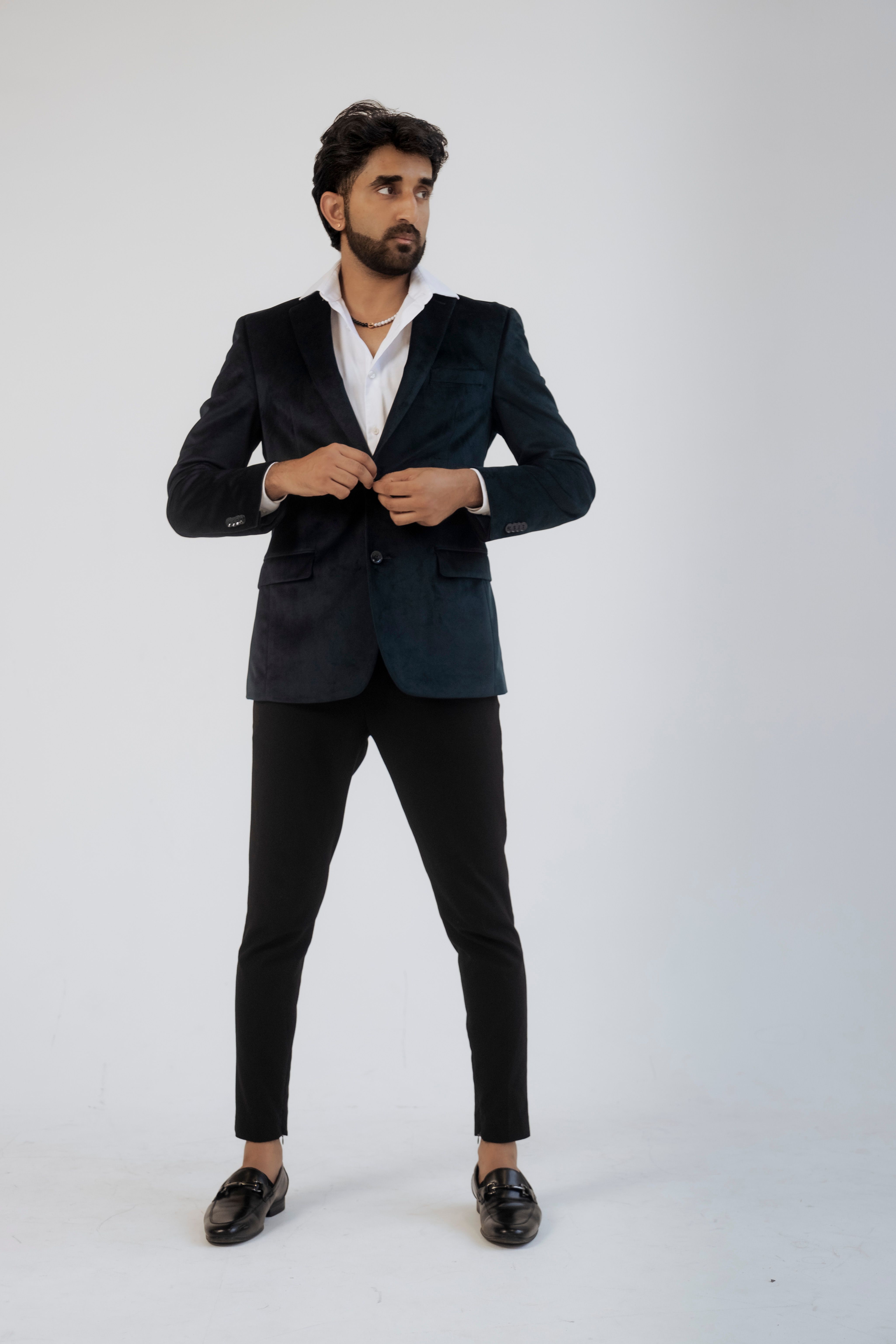 Stylish Man in Black Suit Adjusting Jacket · Free Stock Photo