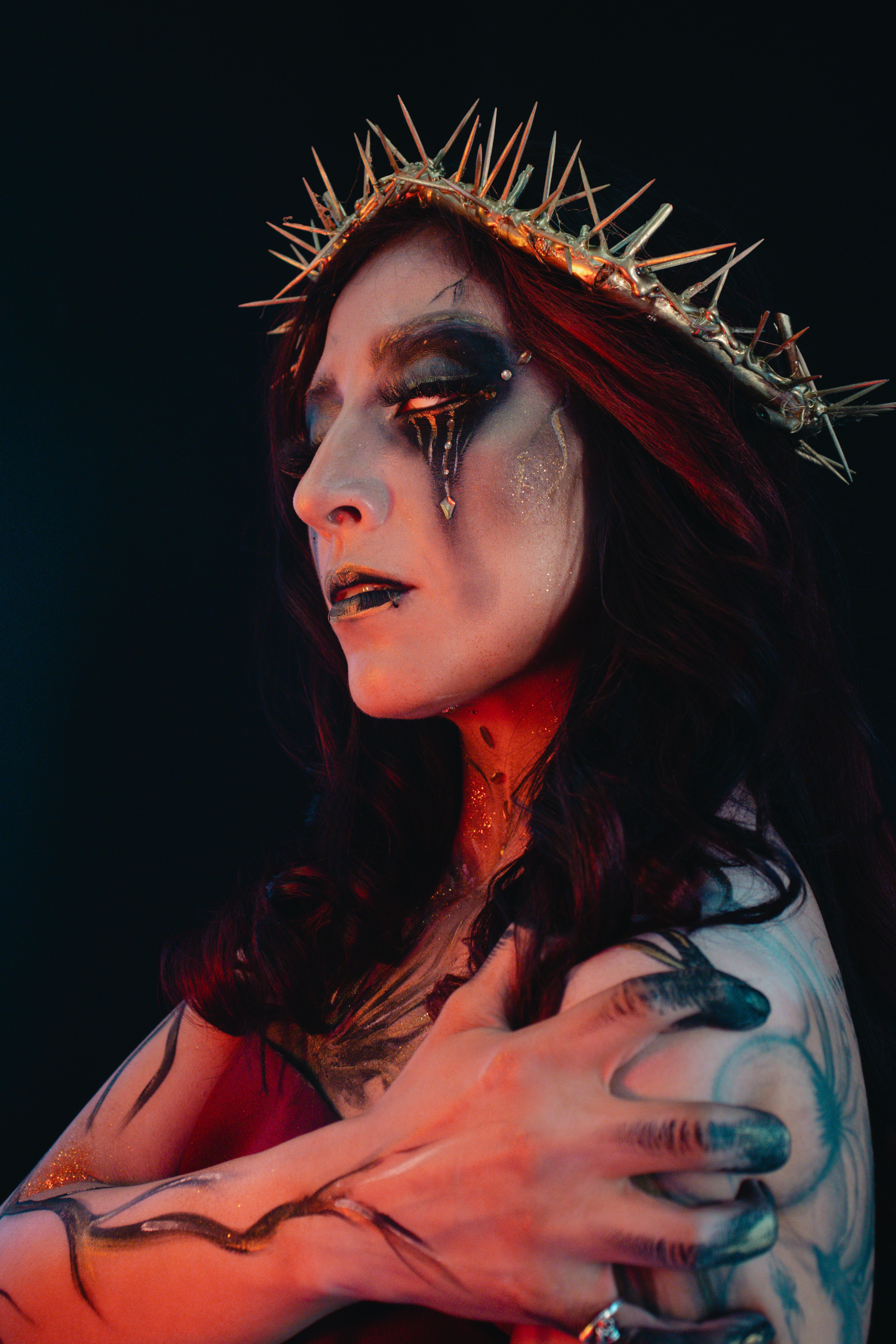 Dramatic Portrait with Artistic Makeup and Crown · Free Stock Photo