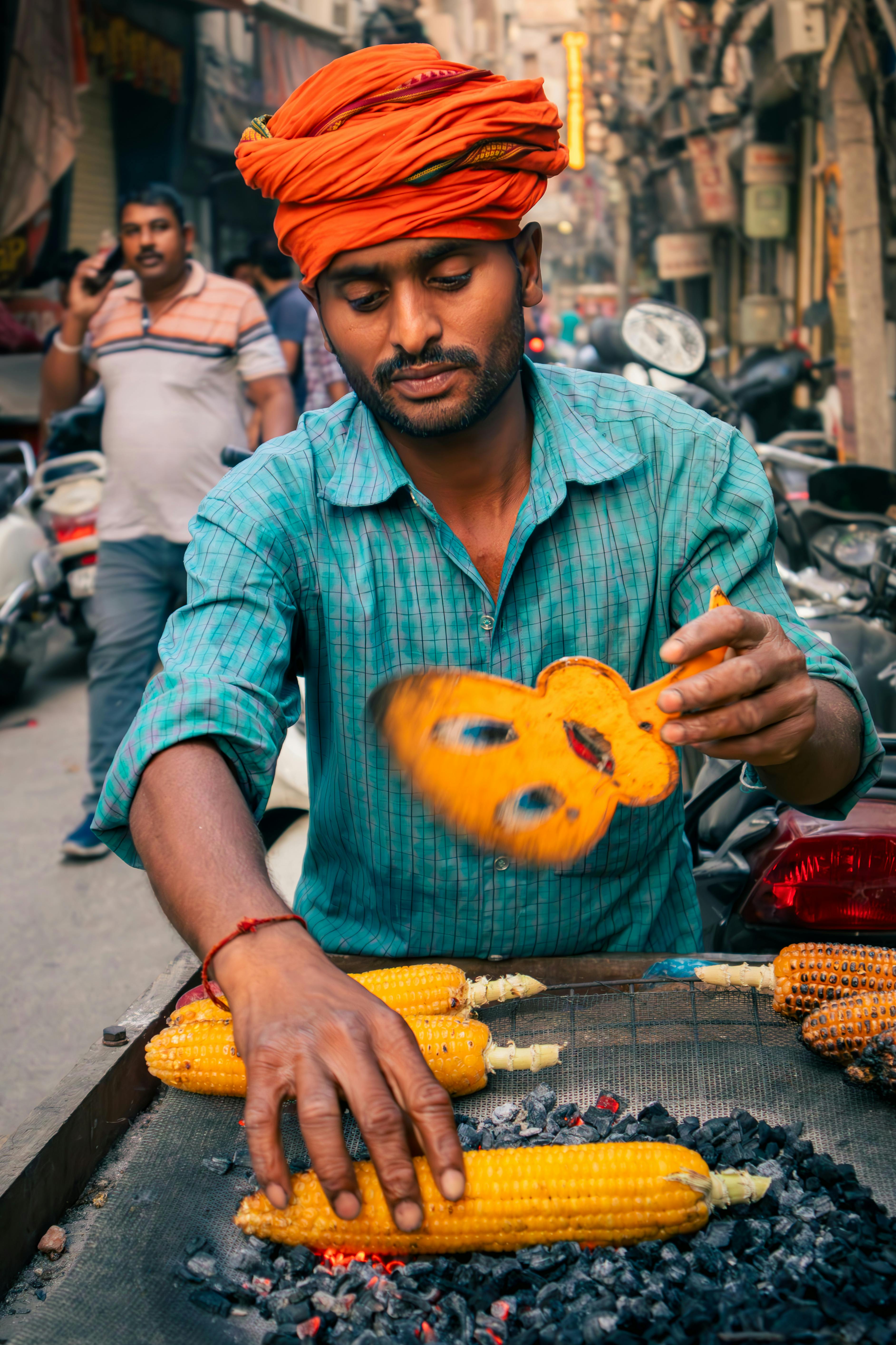 Street Vendor Roasting Corn in Ludhiana Market · Free Stock Photo