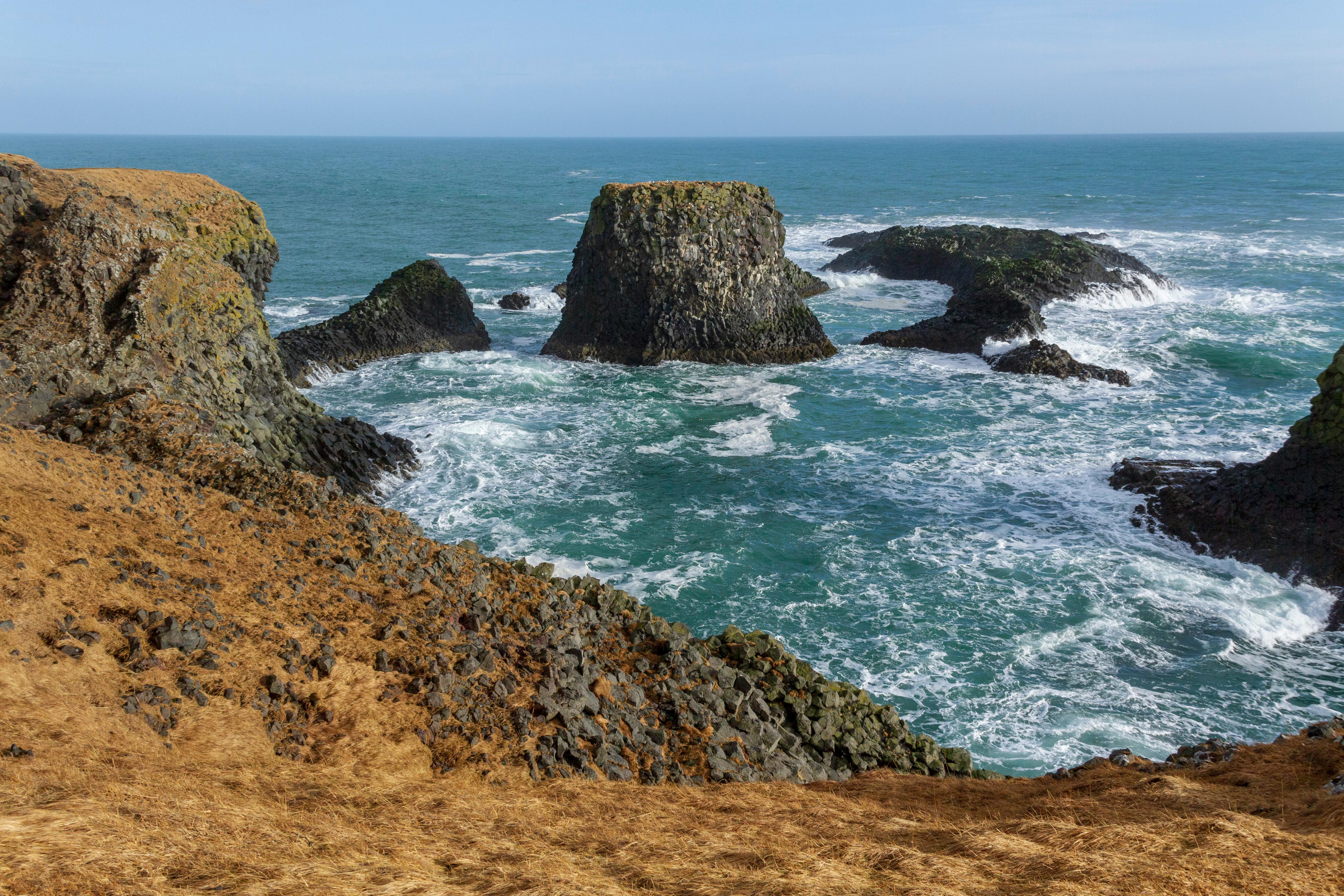 Dramatic Coastal Cliffs and Ocean Waves · Free Stock Photo