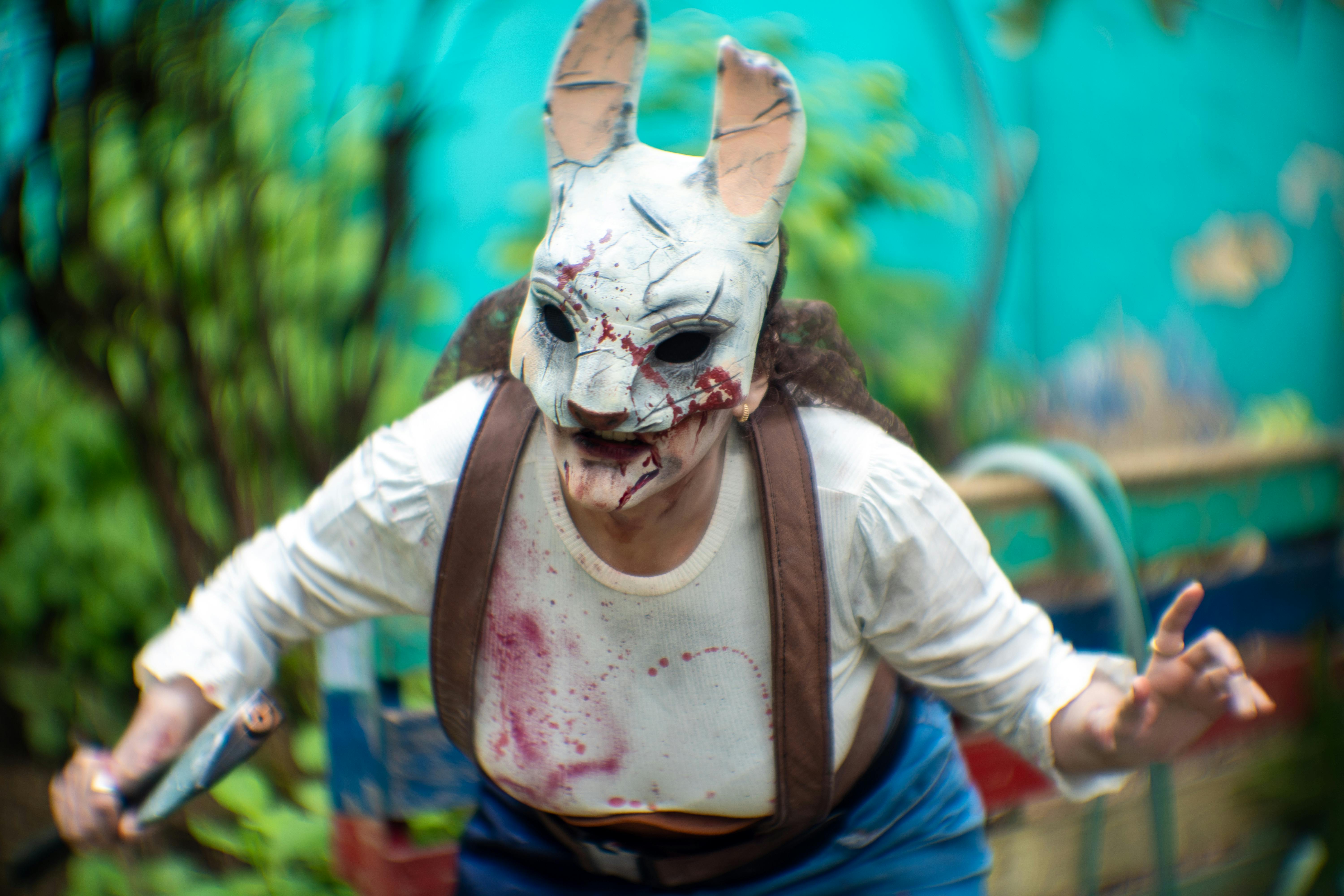 Intense Horror Cosplay in Lush Outdoor Setting · Free Stock Photo