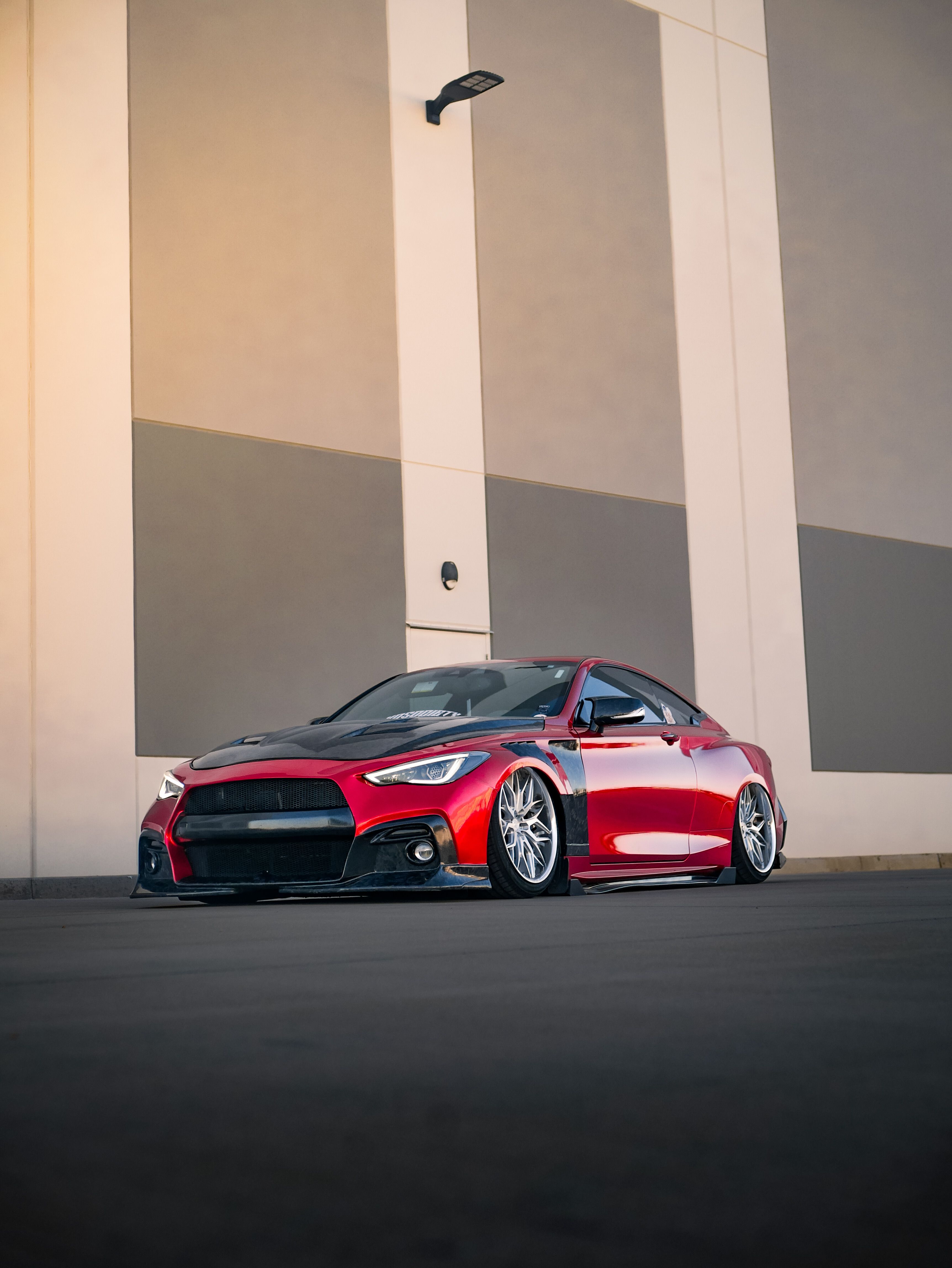 Sleek Red Sports Car in Urban Setting · Free Stock Photo