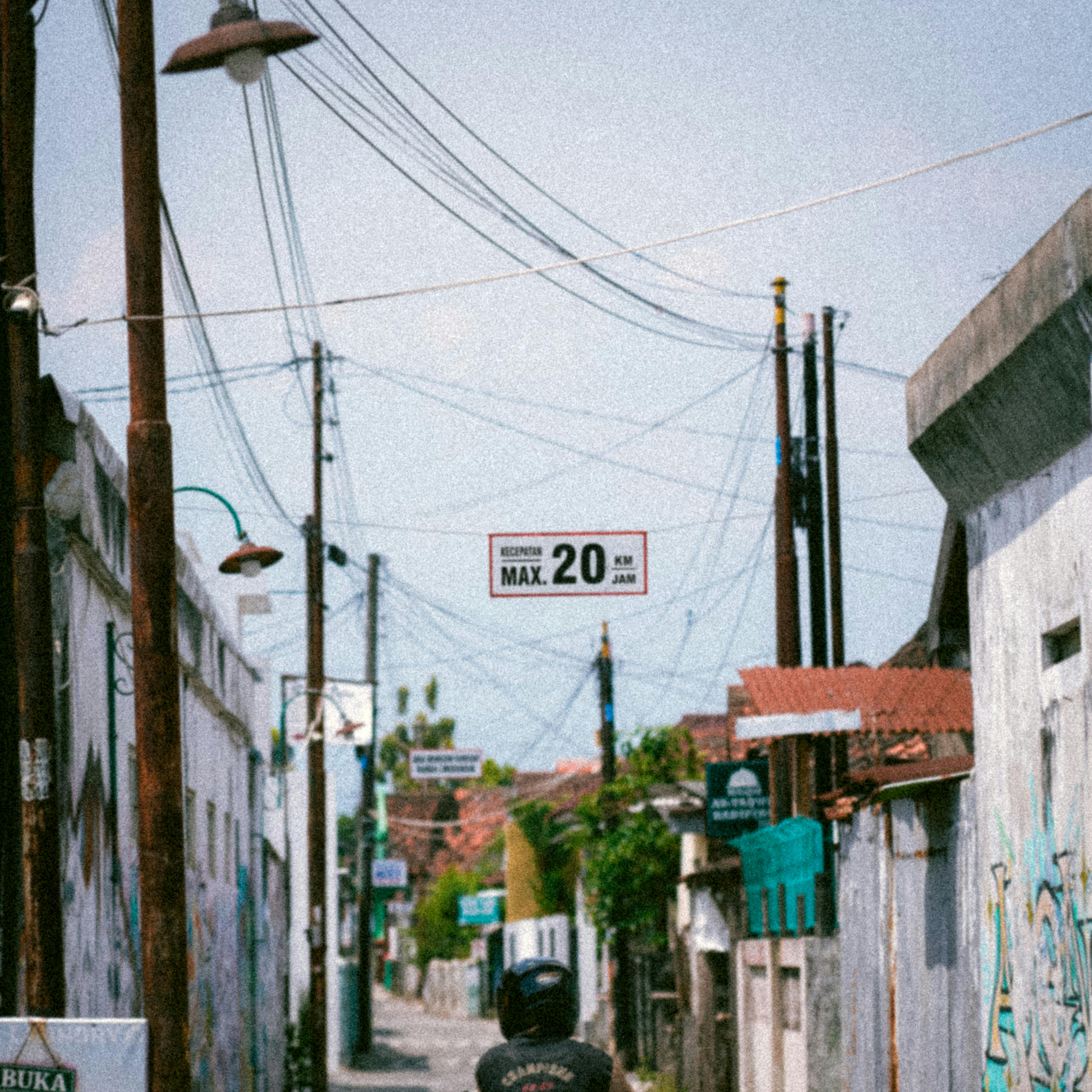 Quaint Street with Utility Poles and Signs · Free Stock Photo