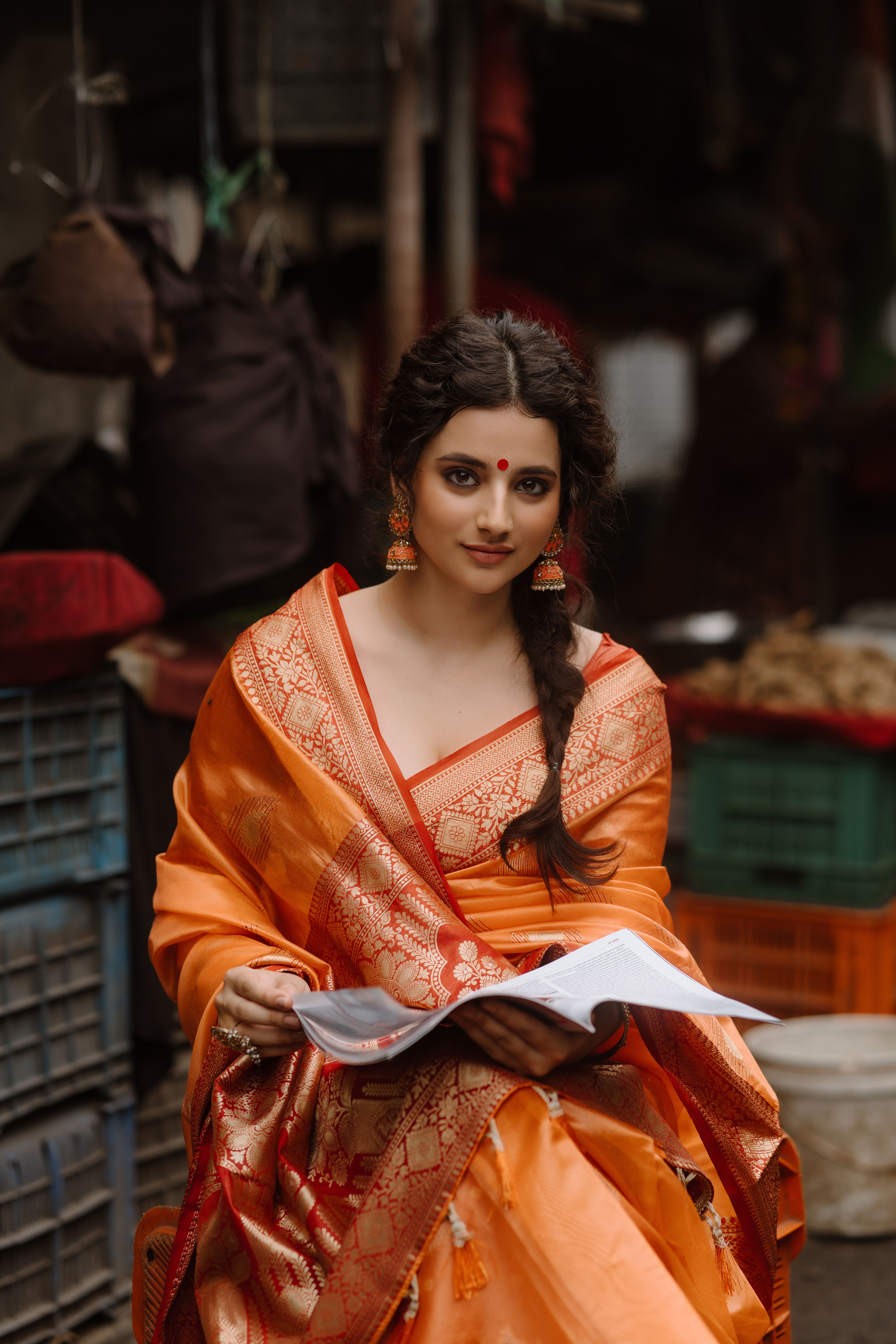 Elegant Woman in Traditional Sari Reading · Free Stock Photo
