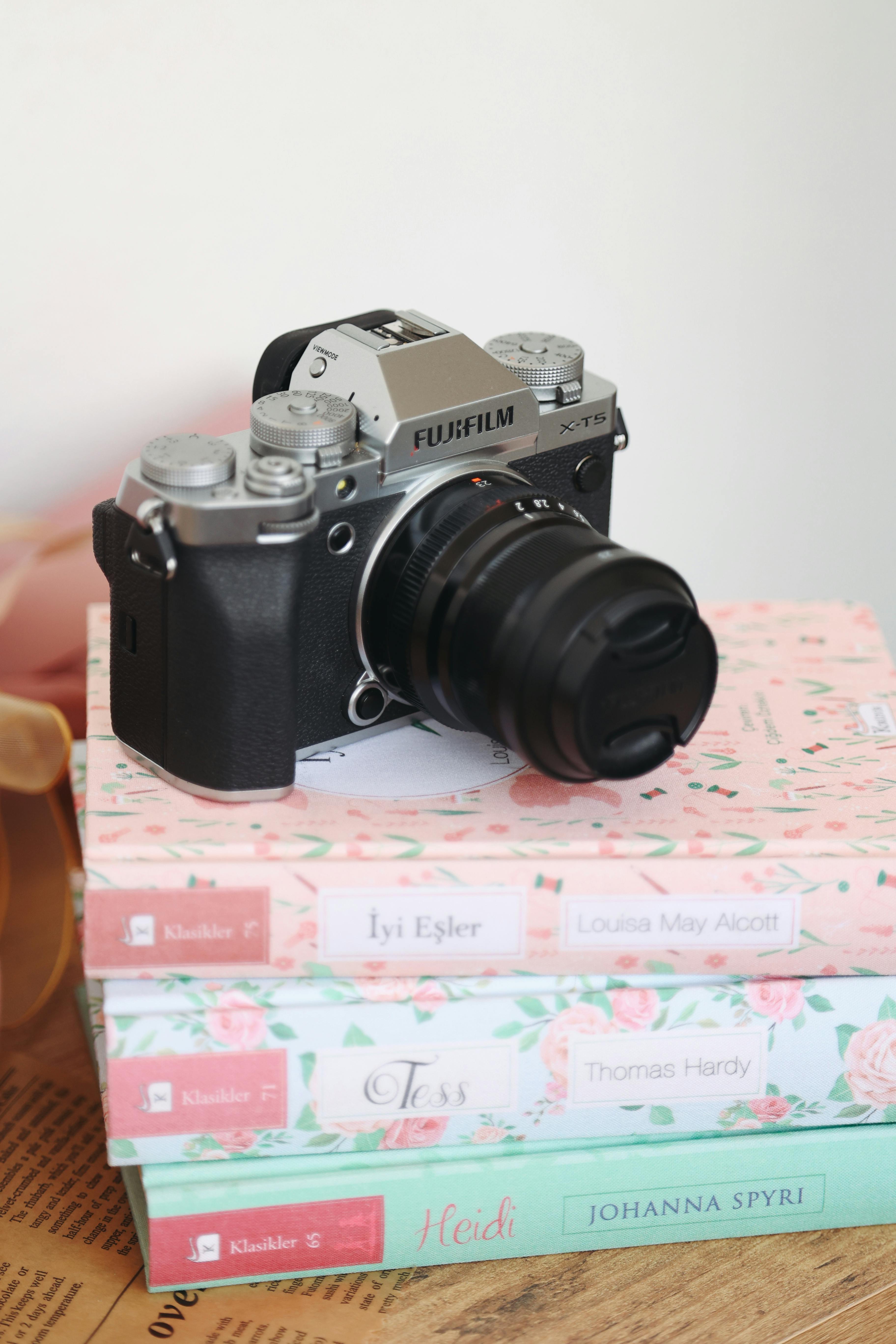 Vintage Camera on Stack of Classic Books · Free Stock Photo