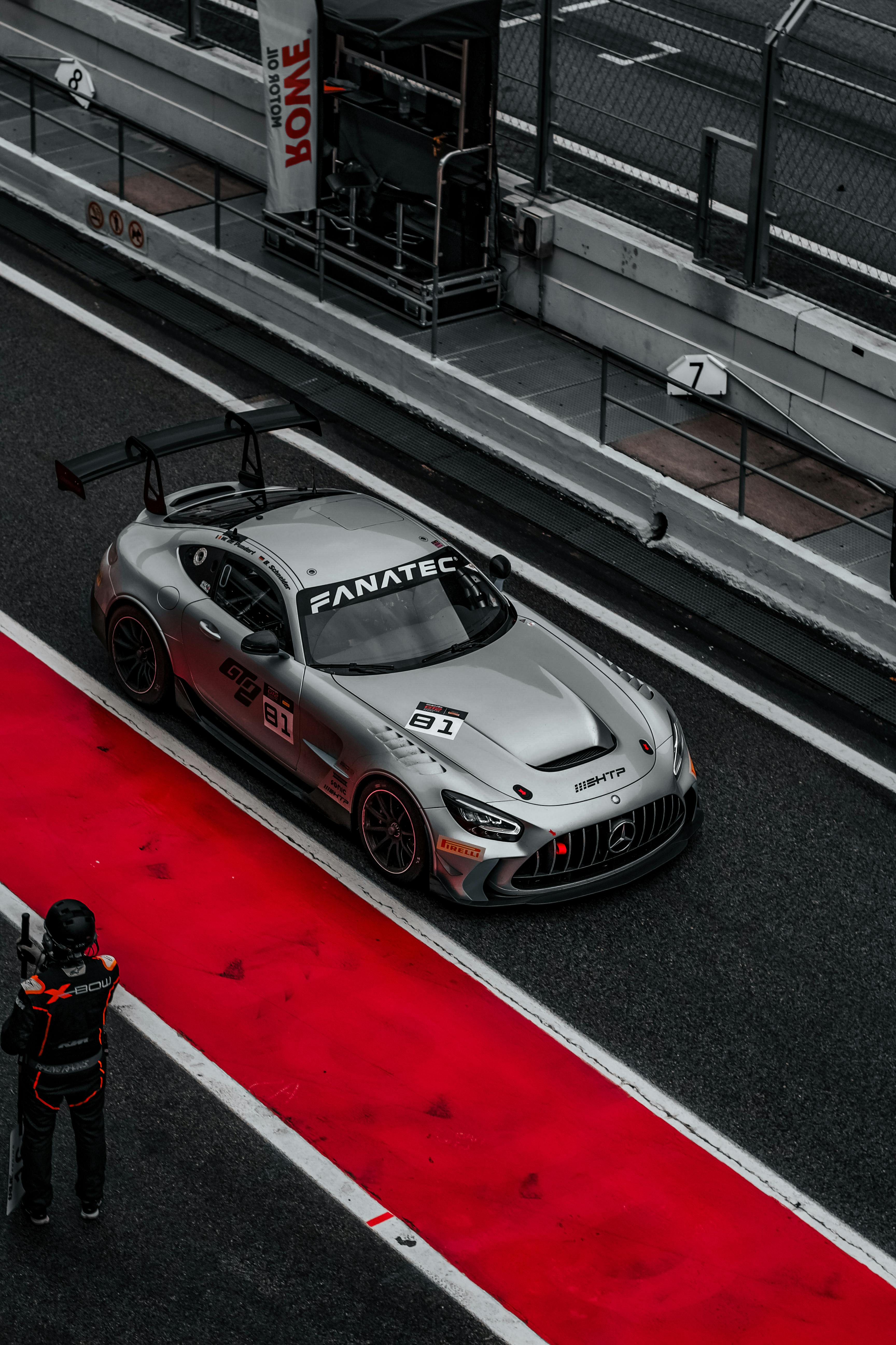 High-Performance Sports Car on Racing Track · Free Stock Photo