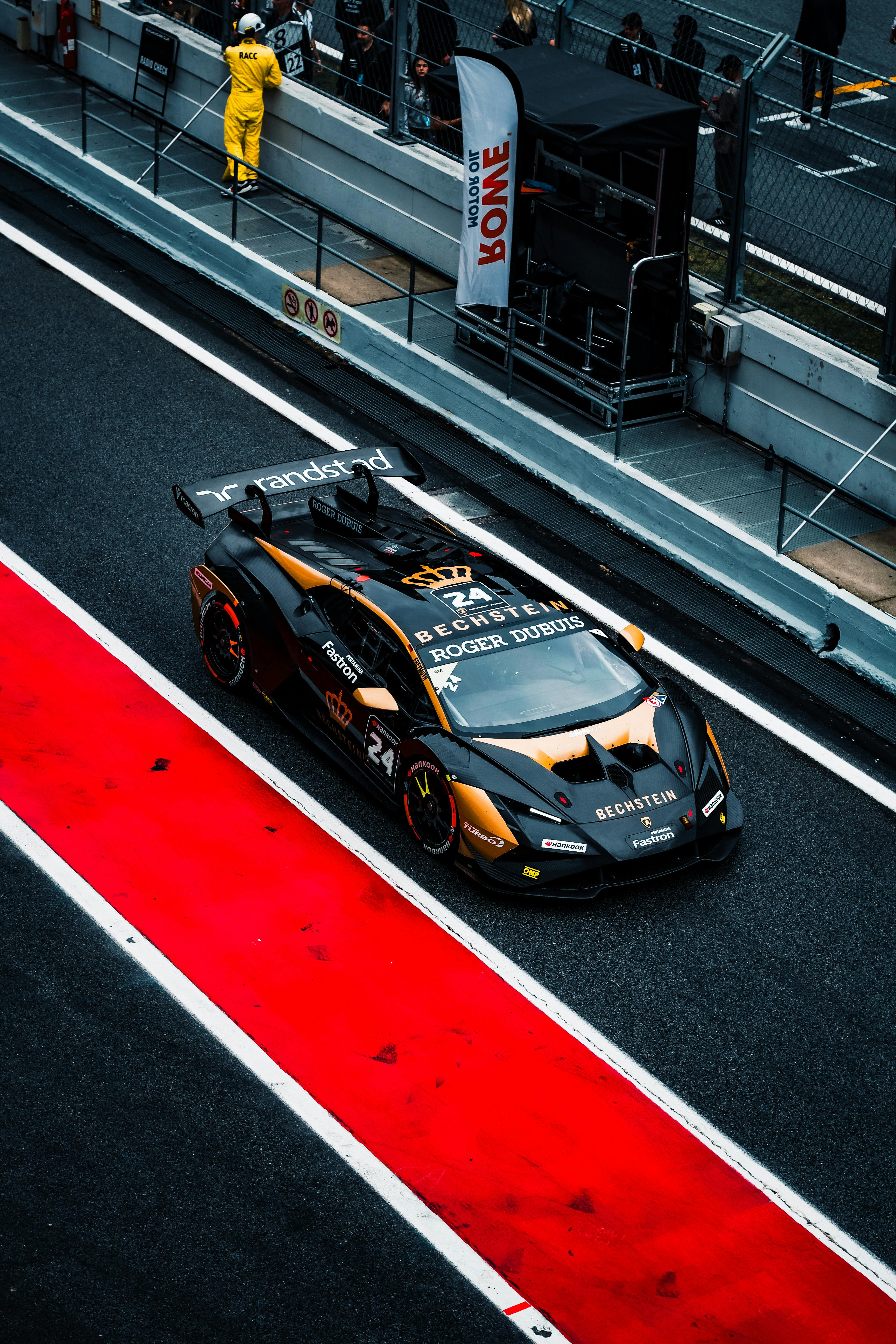 High-speed sports car on racing track · Free Stock Photo