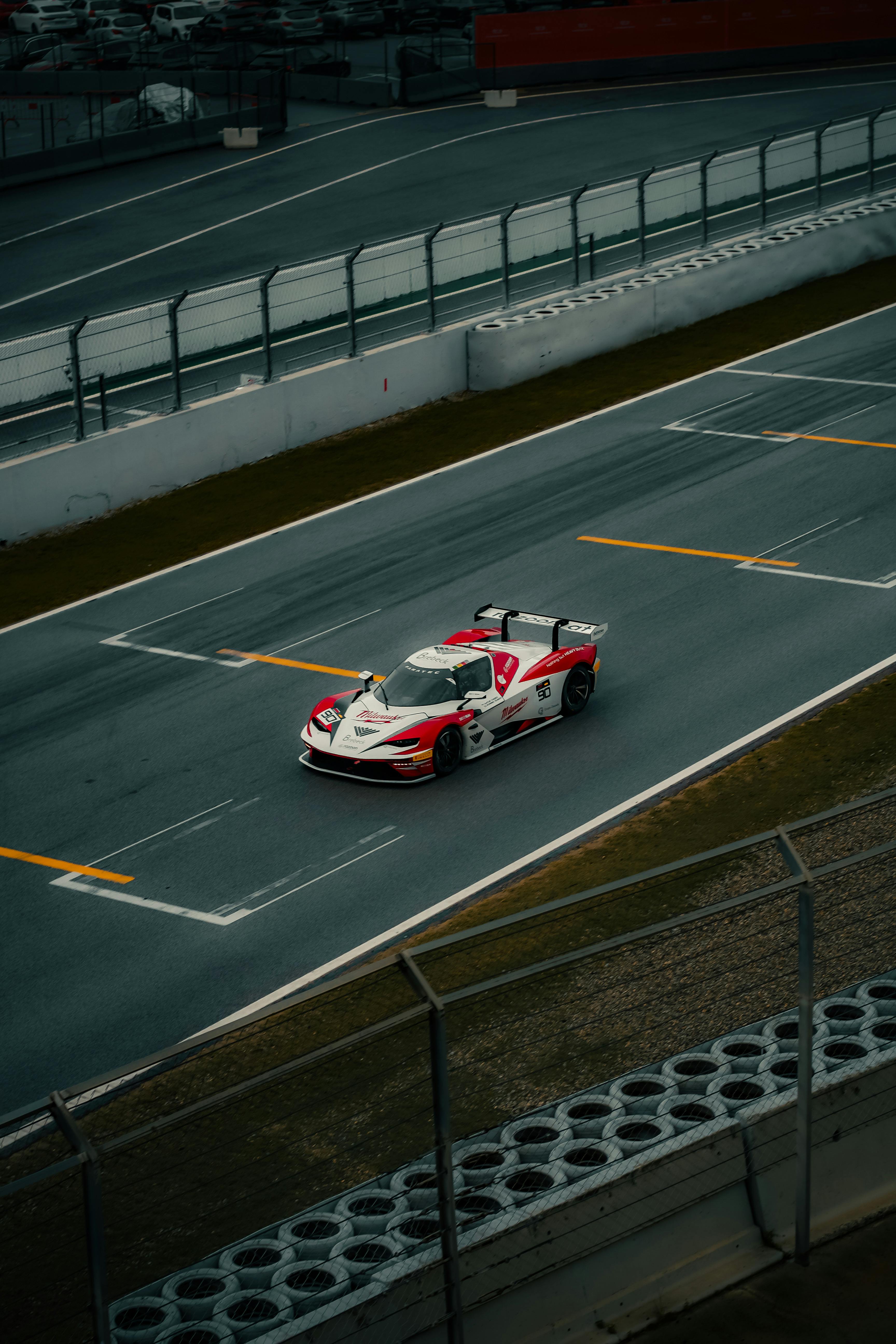 High-speed racing car on professional racetrack · Free Stock Photo