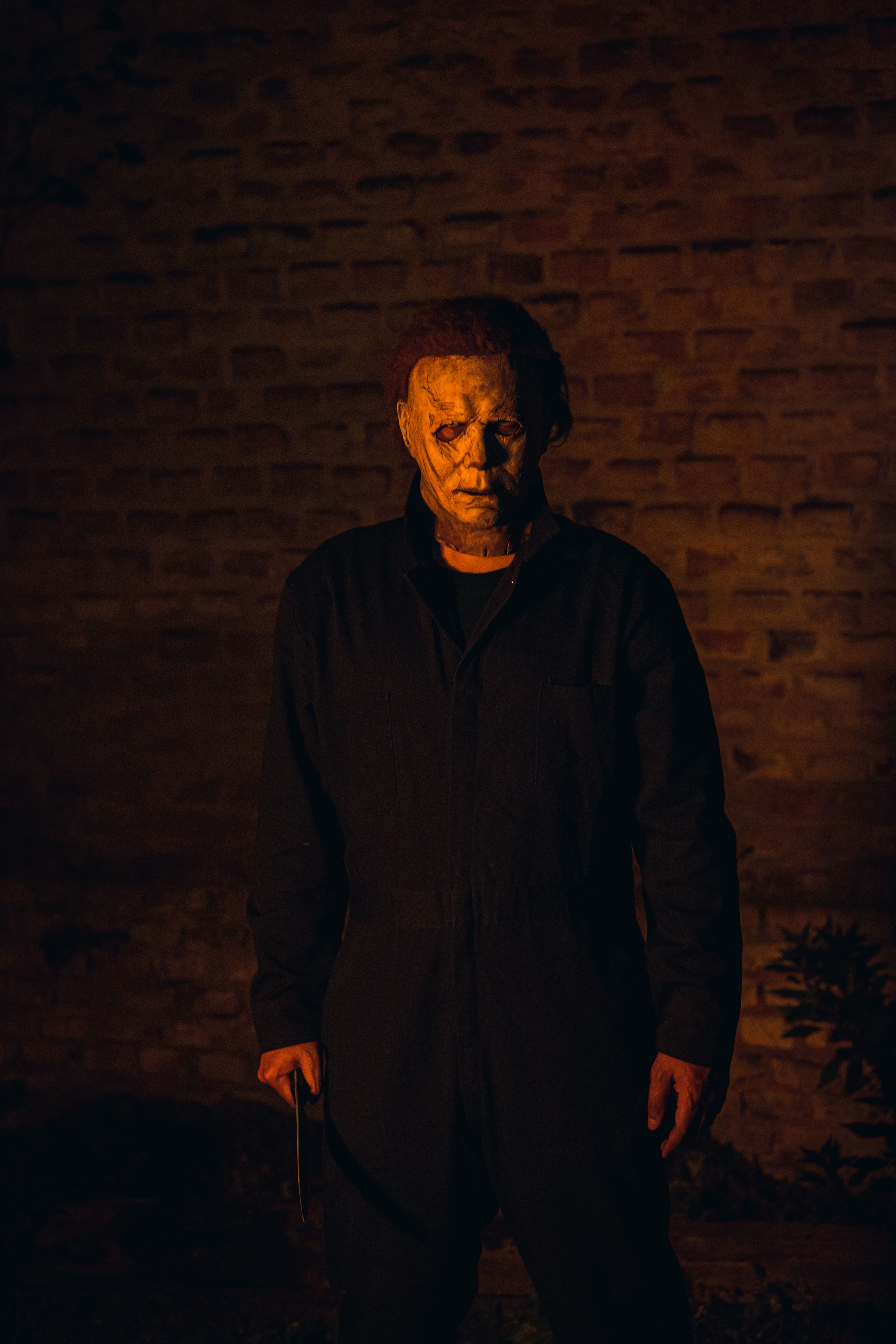 Eerie Masked Figure in Dark Setting · Free Stock Photo