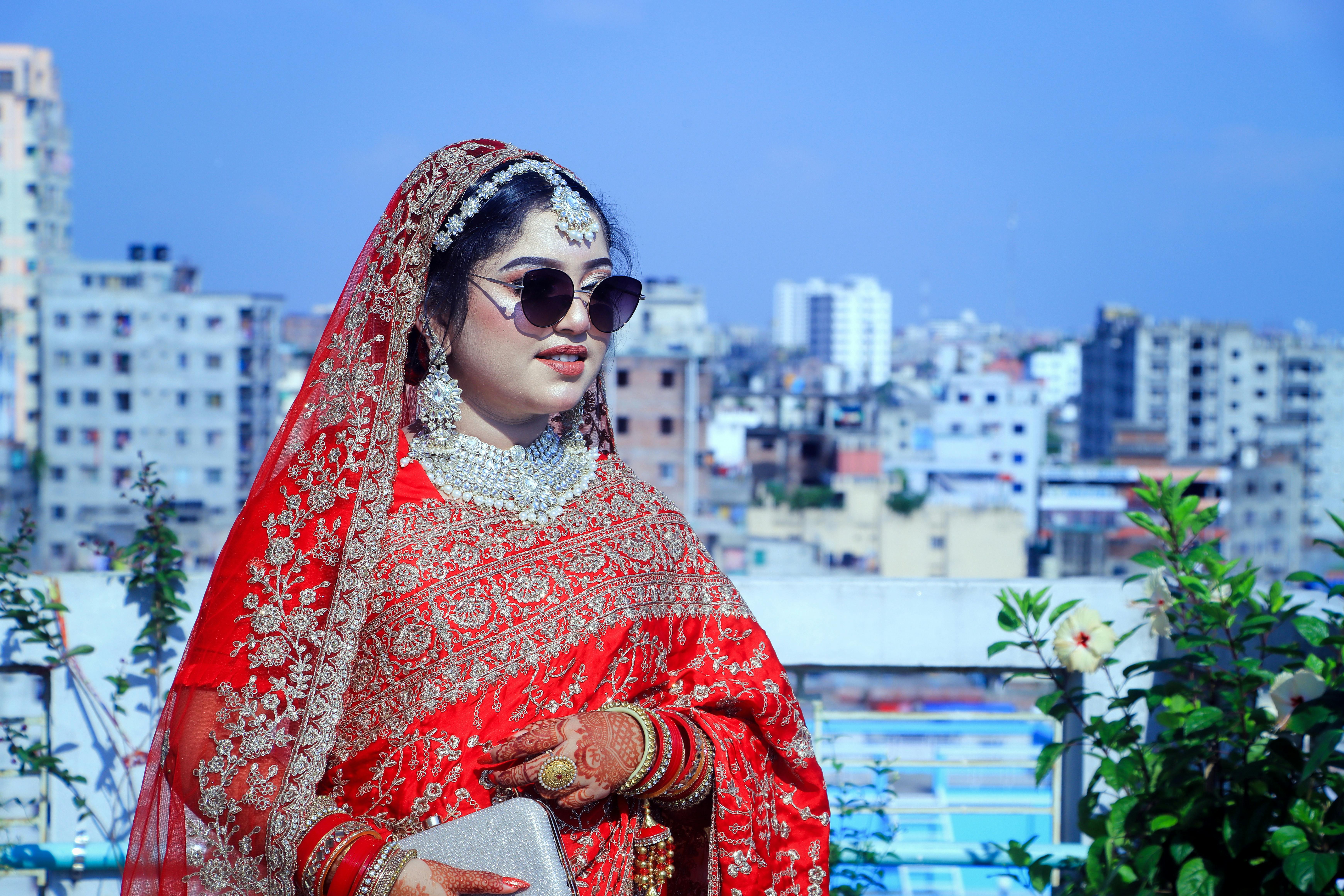 Stunning Bangladeshi Bride in Red Saree Outdoors · Free Stock Photo
