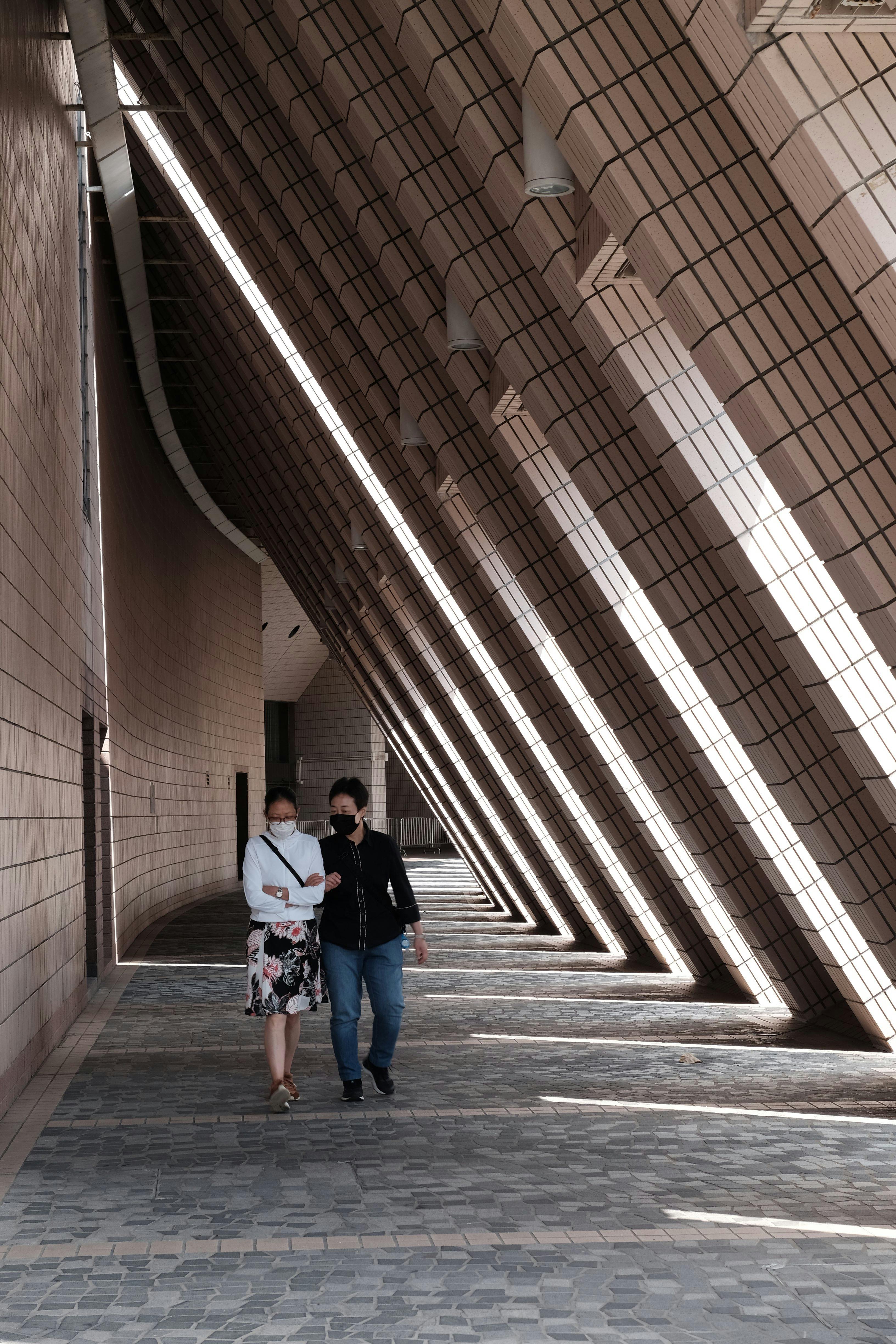 Modern Architecture with Masked People Walking · Free Stock Photo