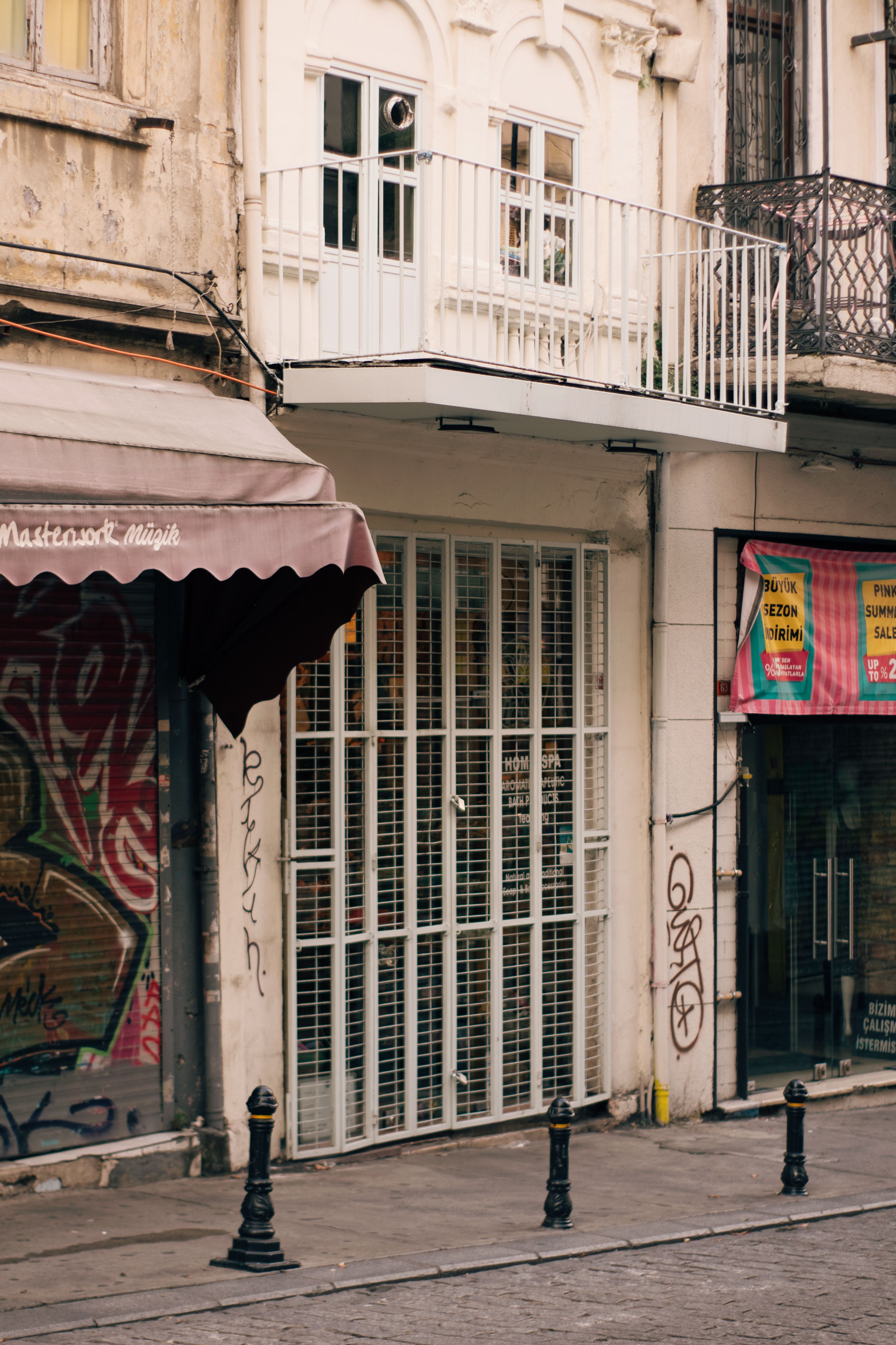 Urban Street with Graffiti on Metal Shutter · Free Stock Photo