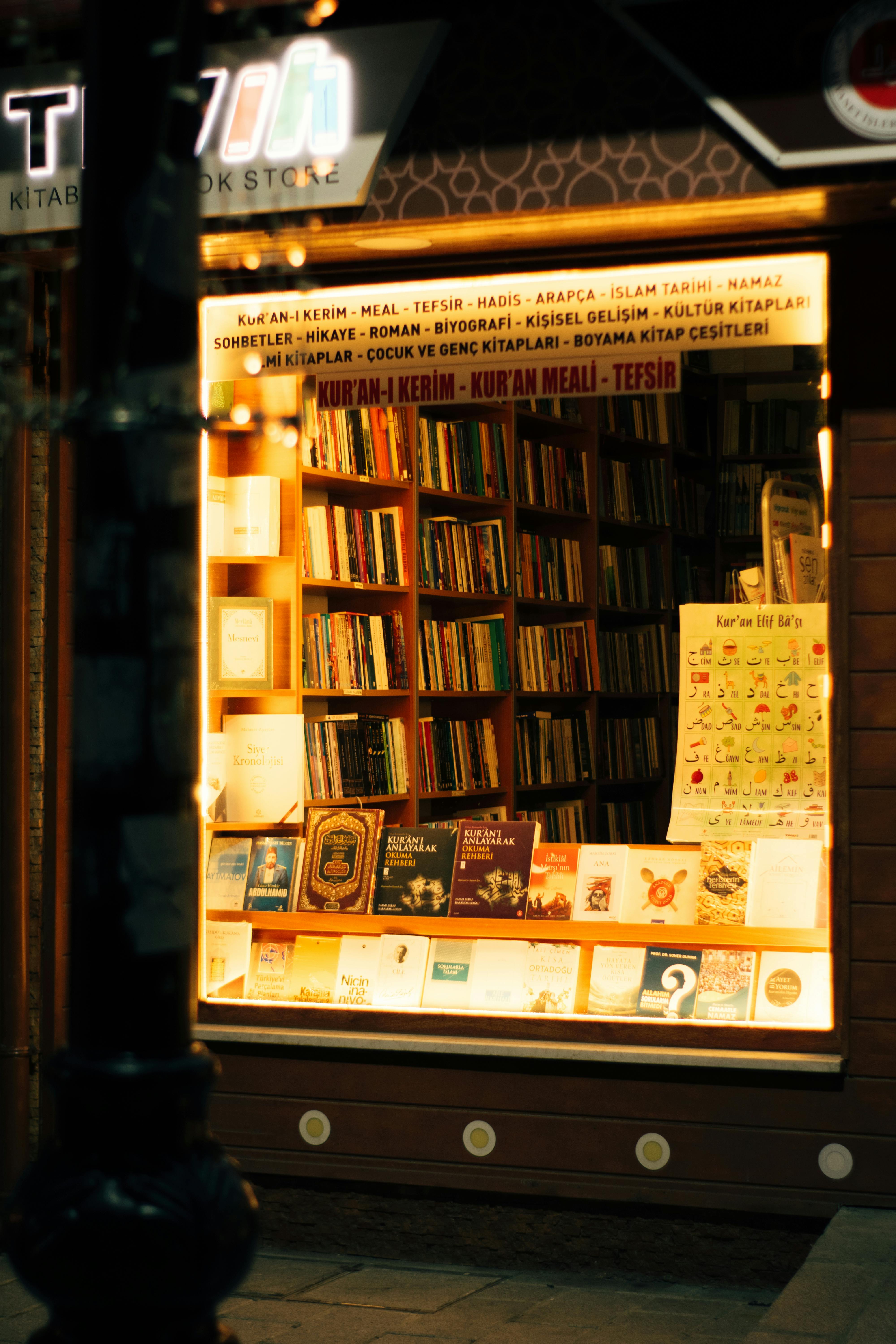 Cozy Bookstore Window Display at Night · Free Stock Photo